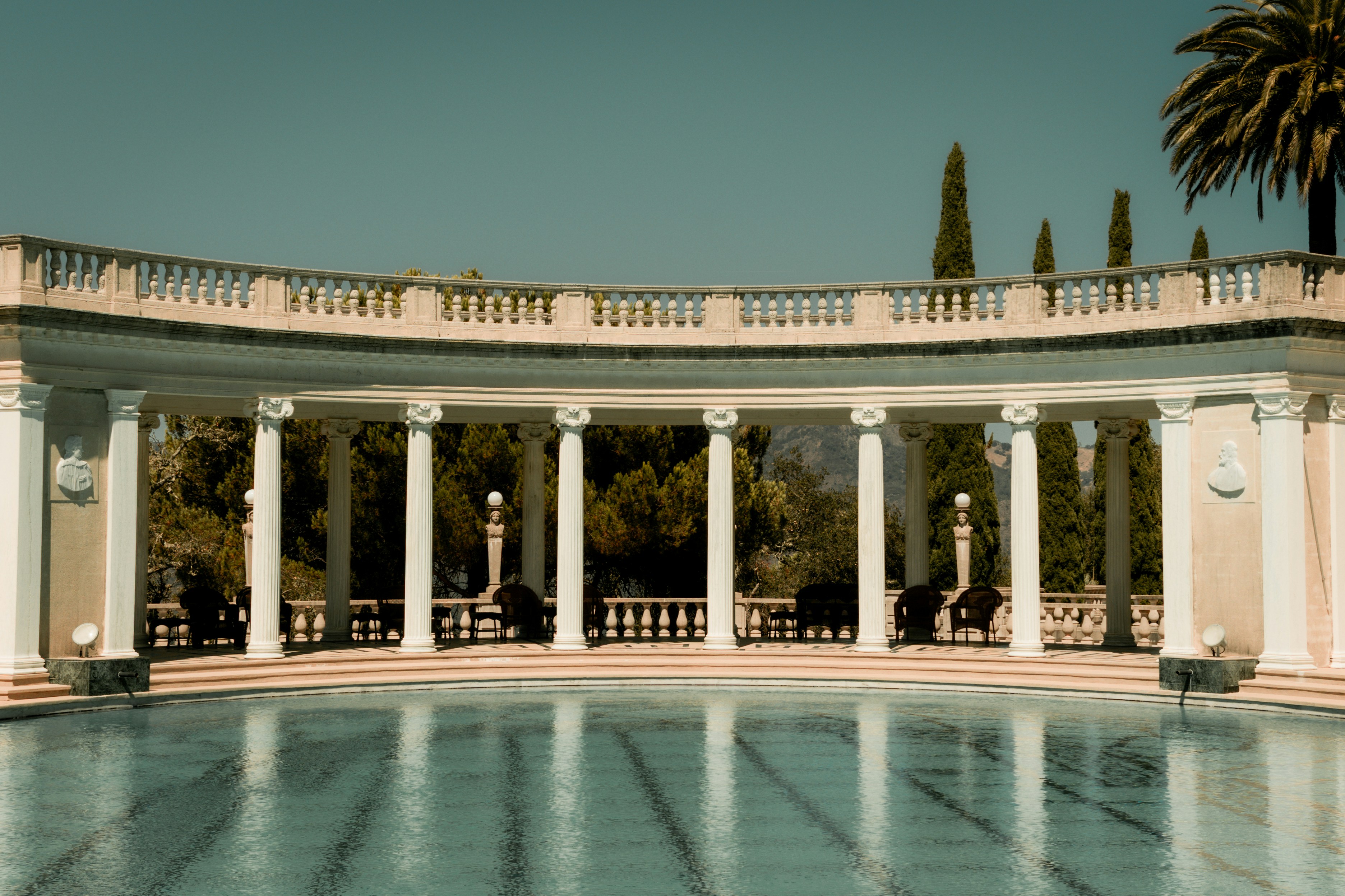 Sunlit Arcade Over the Reflective Pool