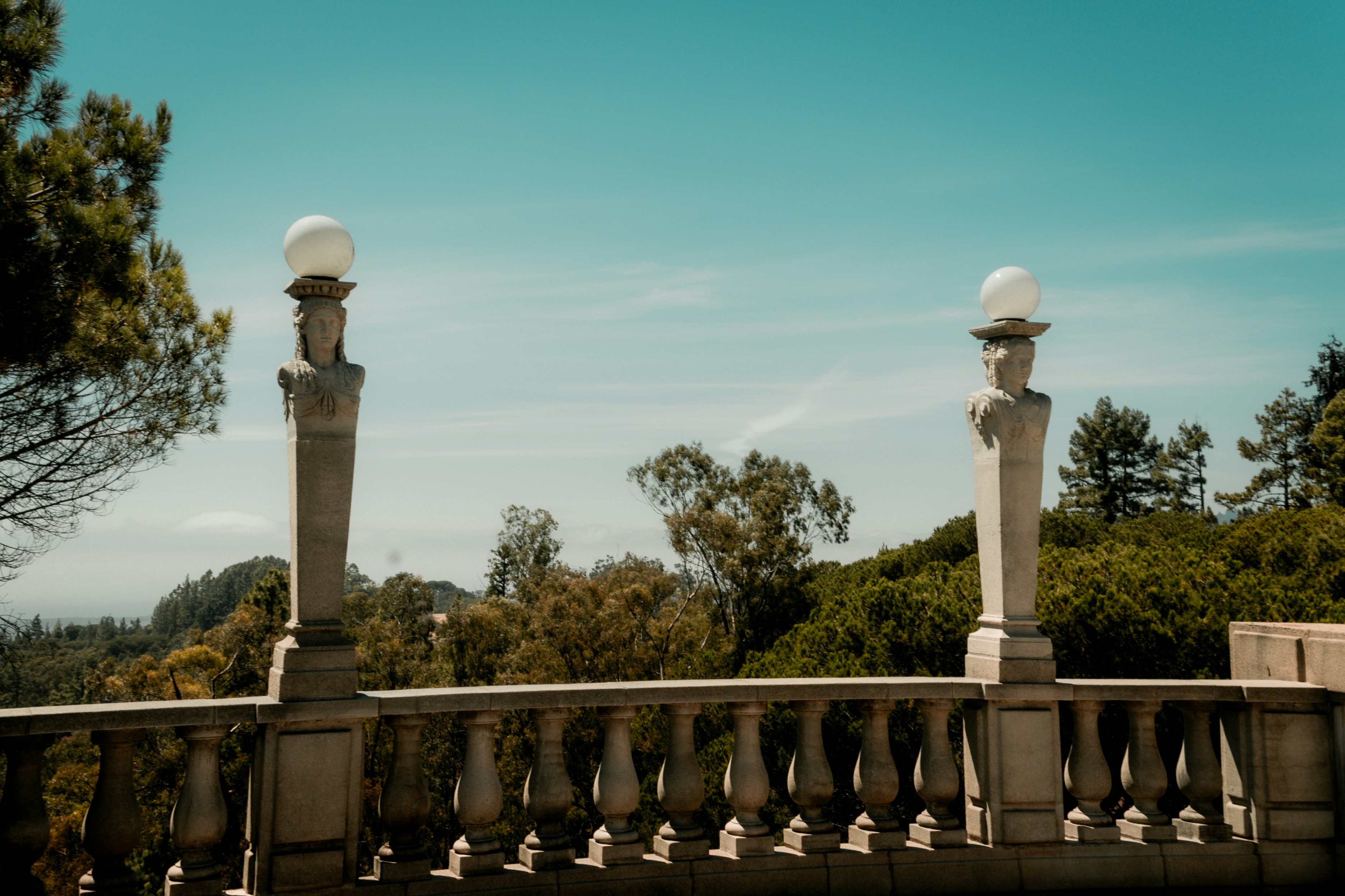 Stone Balustrade Vista: Symmetry Under a Sky of Teal