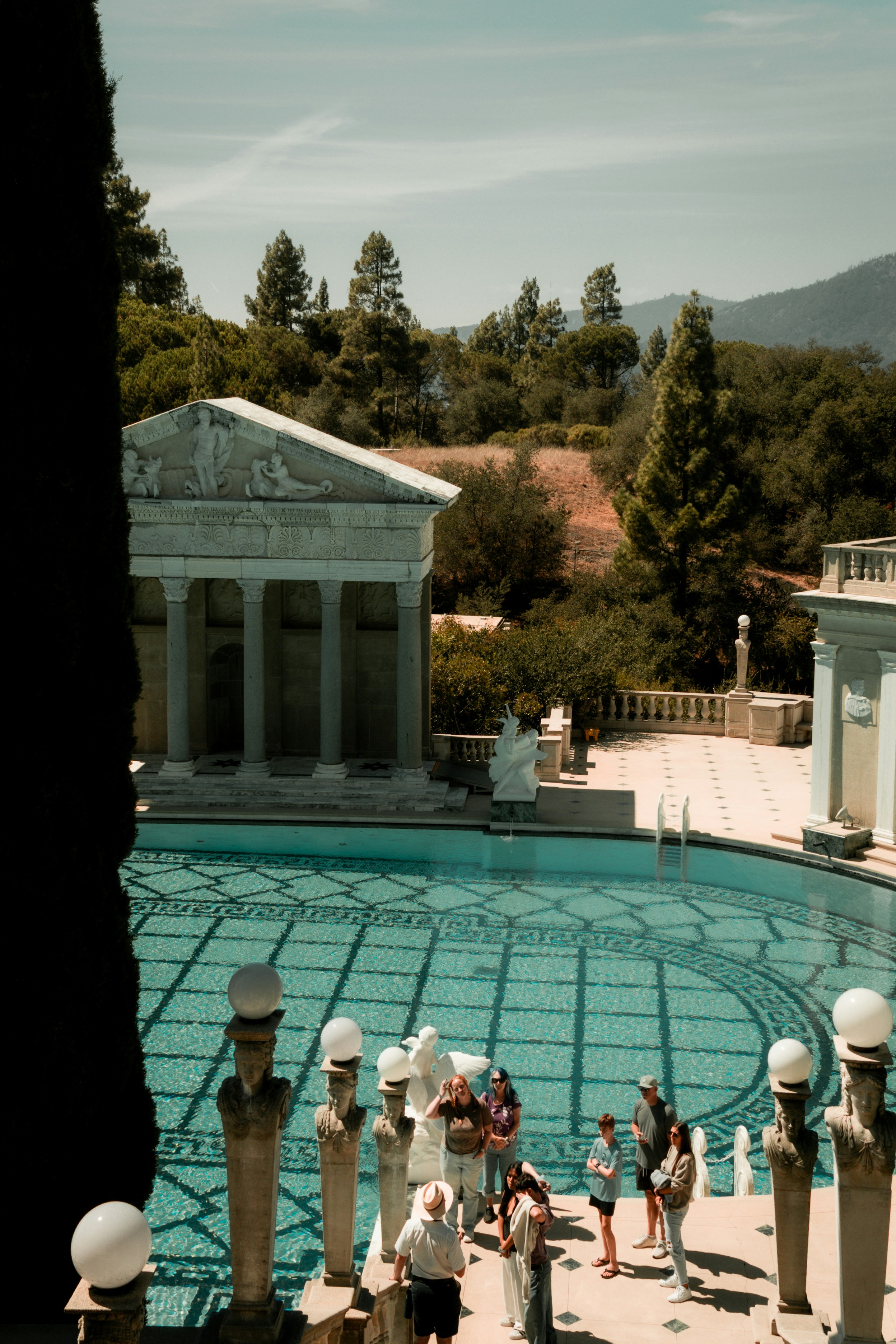 Terraced Poolfront Sanctuary: Columns, Statues and a Mountain Vista