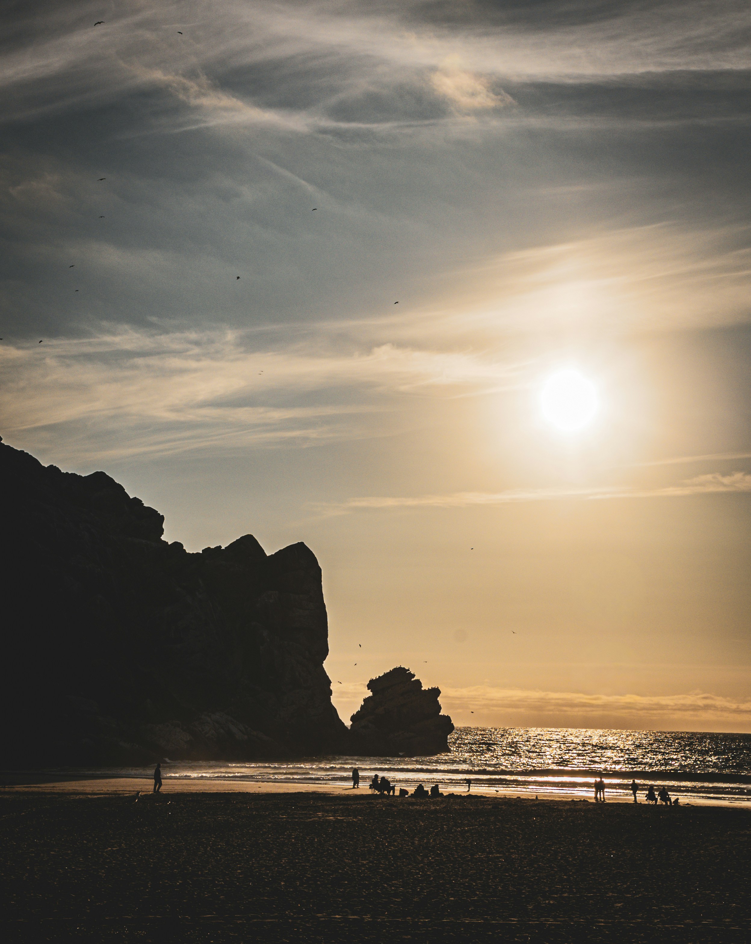 Sunlit Shoreline Beneath a Quiet Cliffs