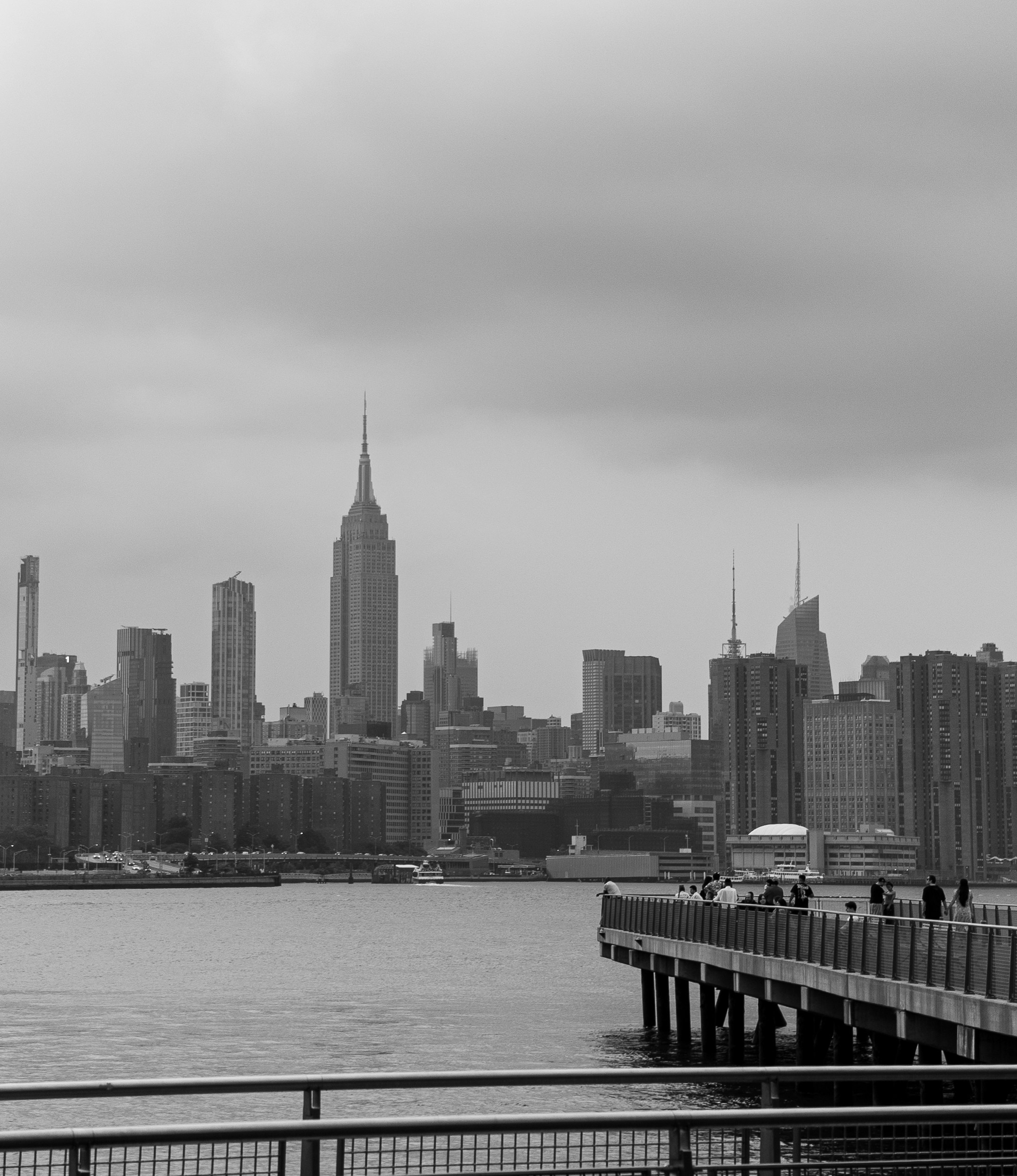 City at Dusk: Pier and Skyline in Monochrome