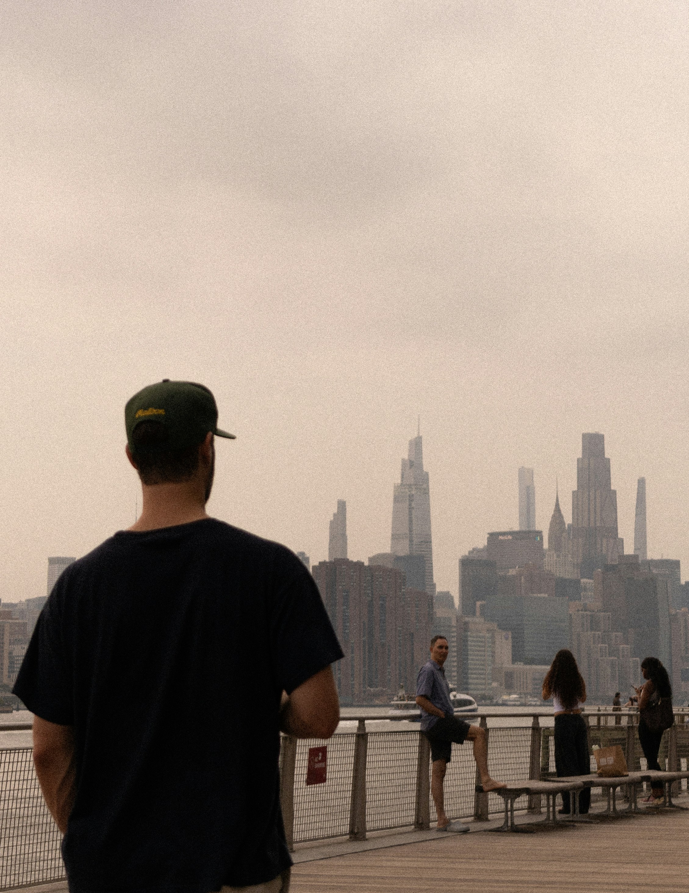 Backlit Promenade: A Quiet Moment with the City’s Horizon