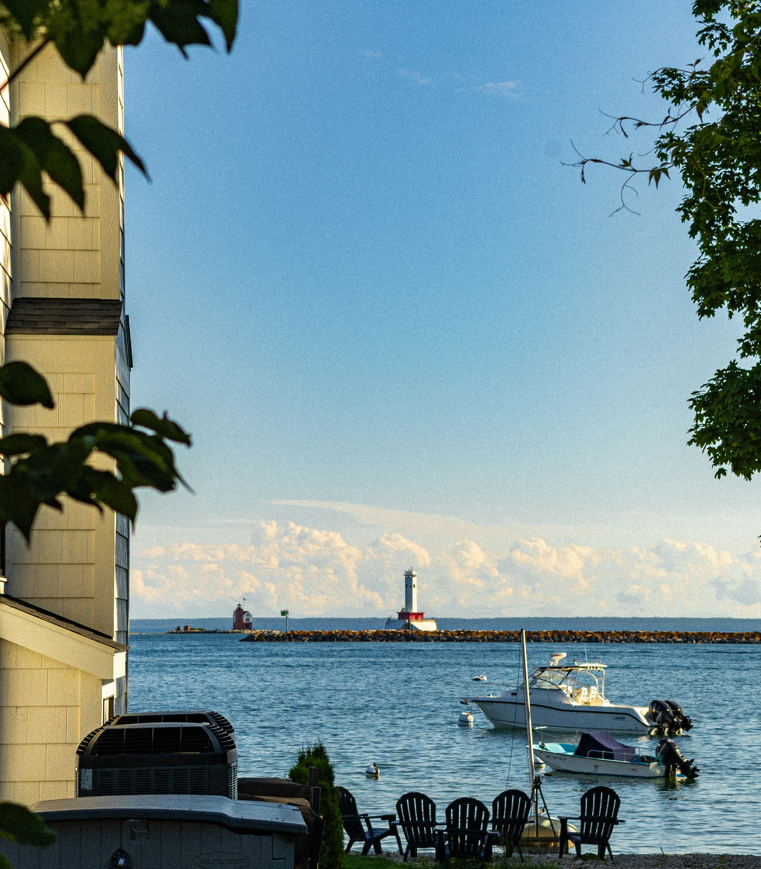Harbor Quietude: A Seaside Balcony Framing the Lighthouse Foreshore
