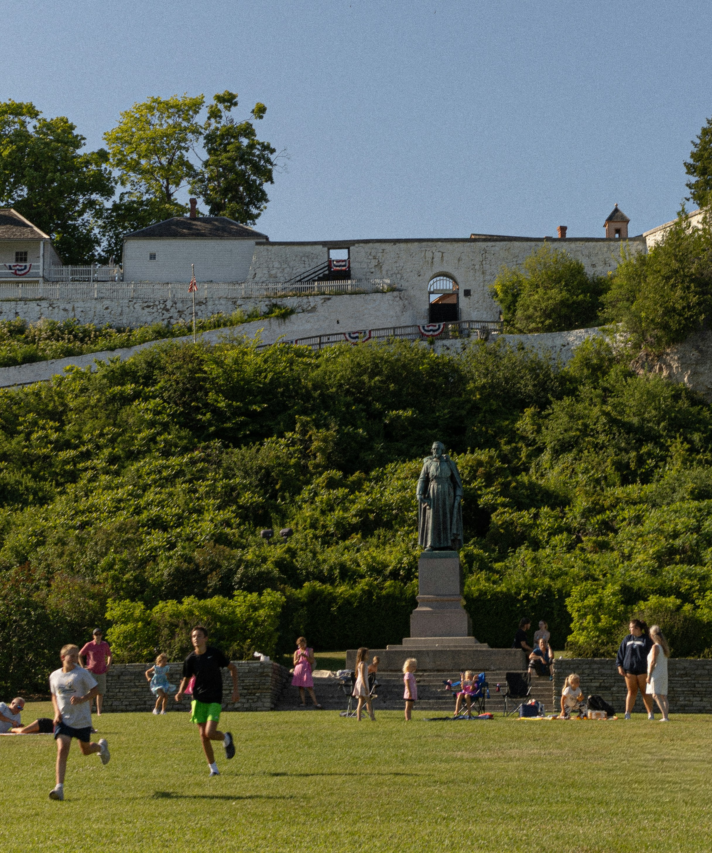 Statue amid the hillside park: a sunny day of motion and quiet history