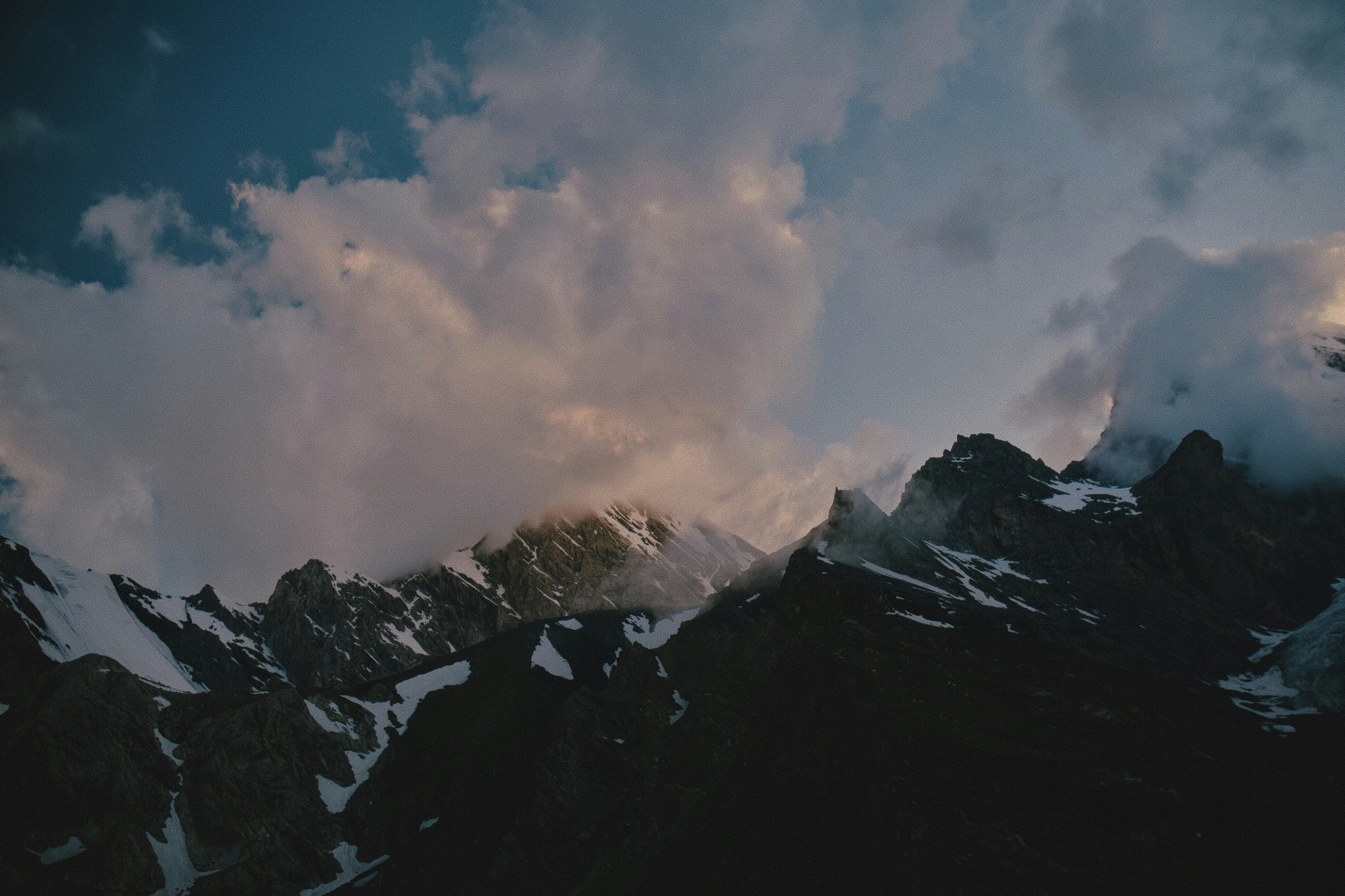 Whispered Peaks Beneath a Cloudlit Sky