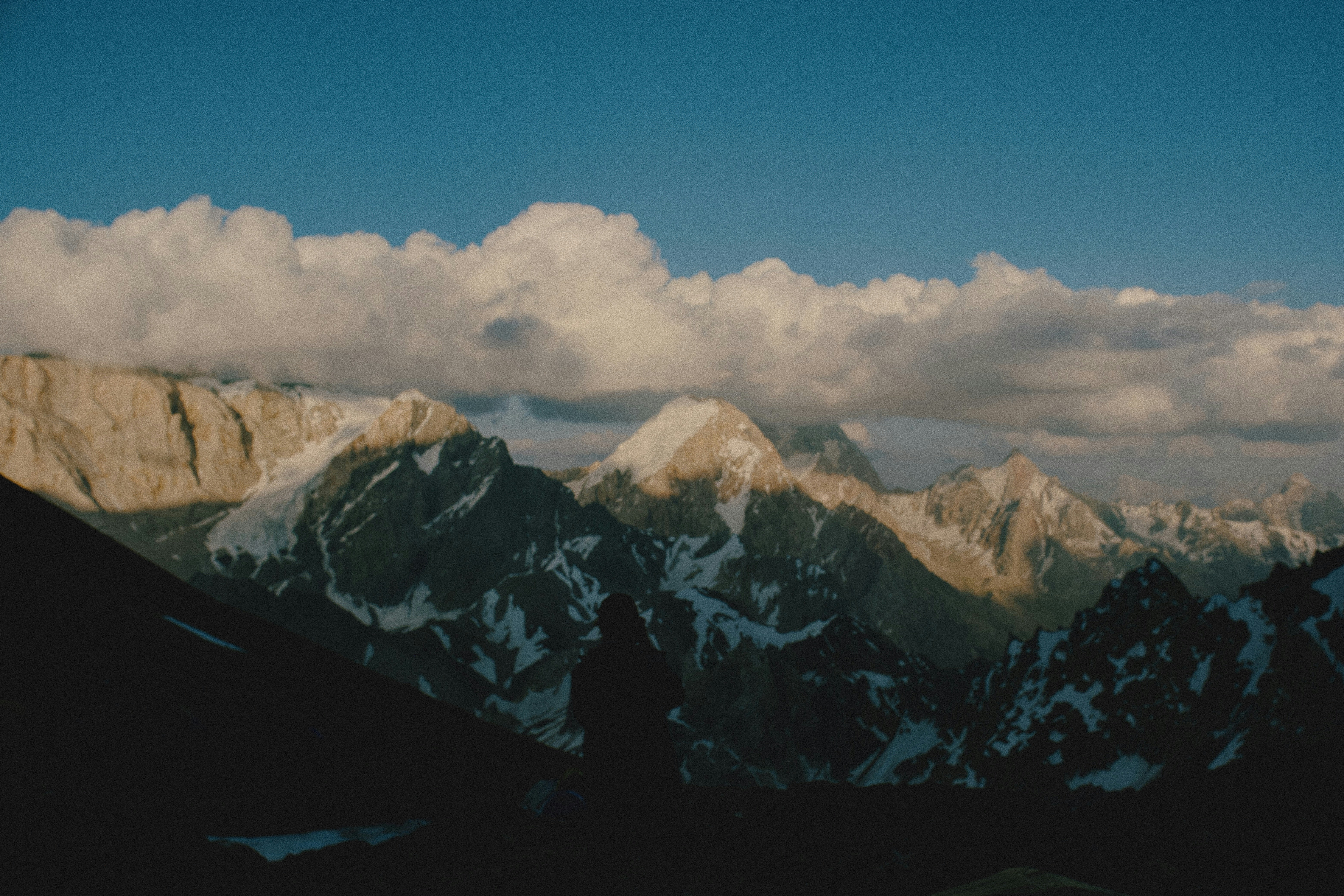 Silhouette Against the Alpine Crown at Dusk