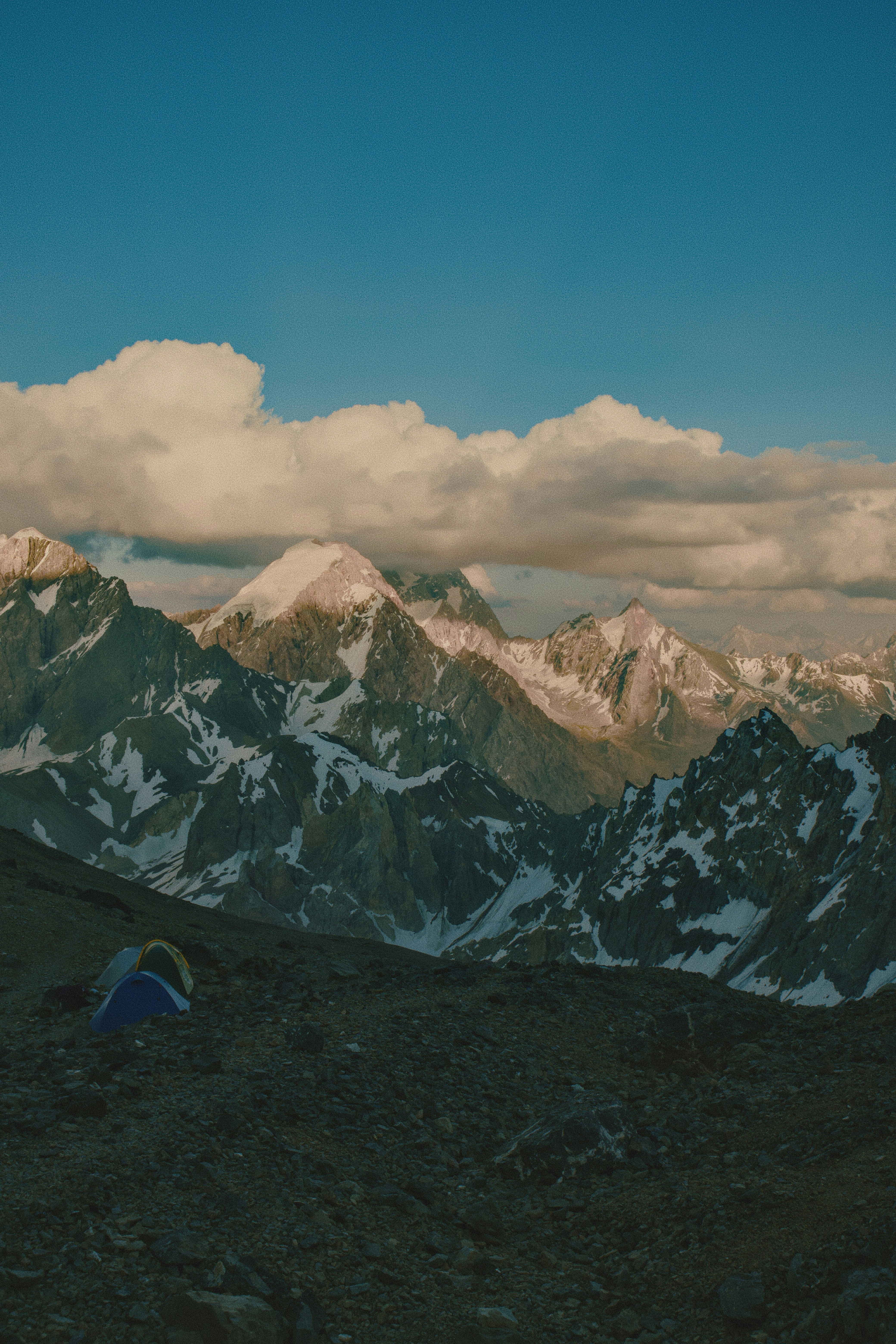 Snowy Peaks at Twilight: A Lone Camp beneath the Giants