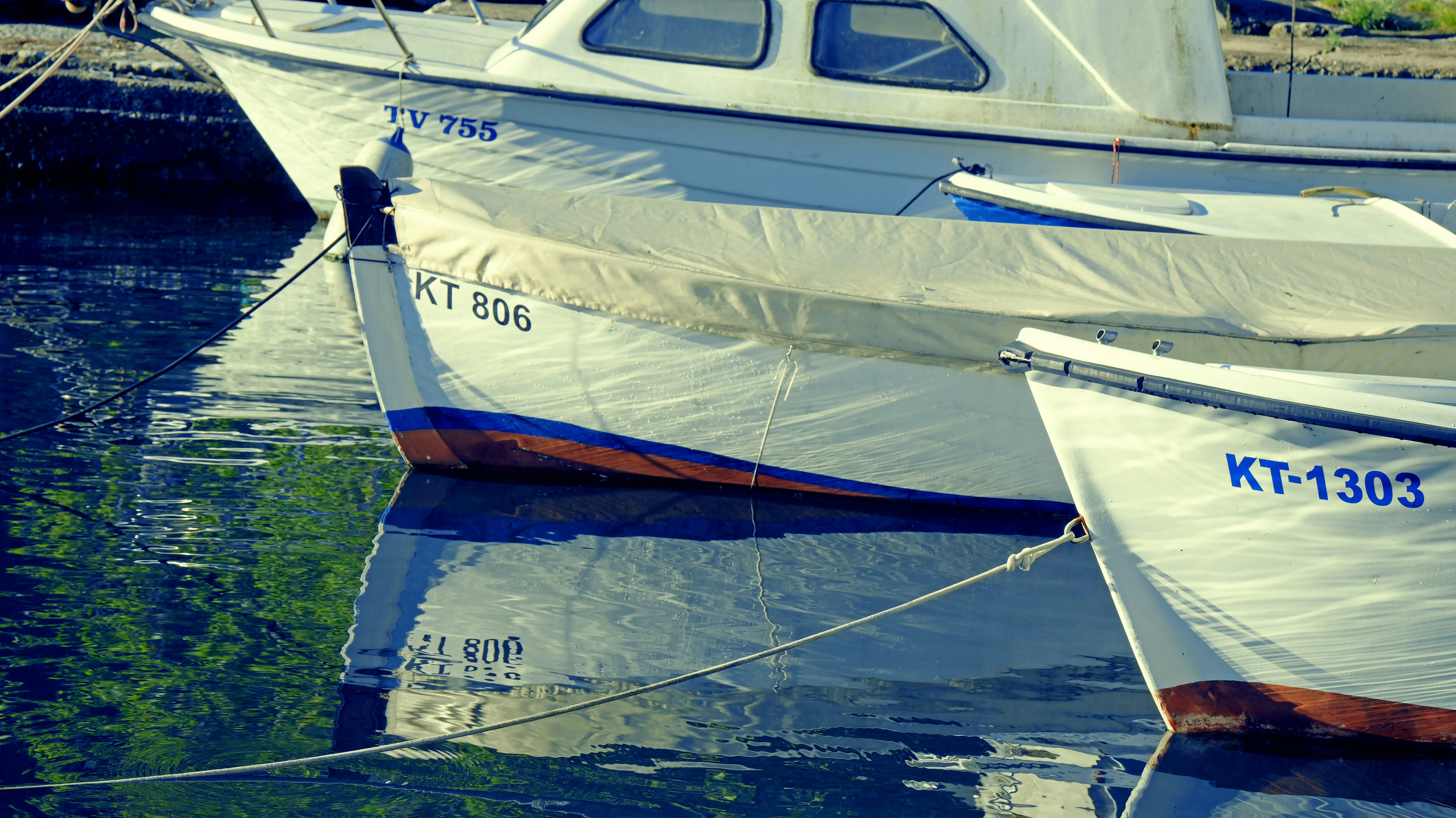 Dockside Reflections: Boats Resting in Quiet Water