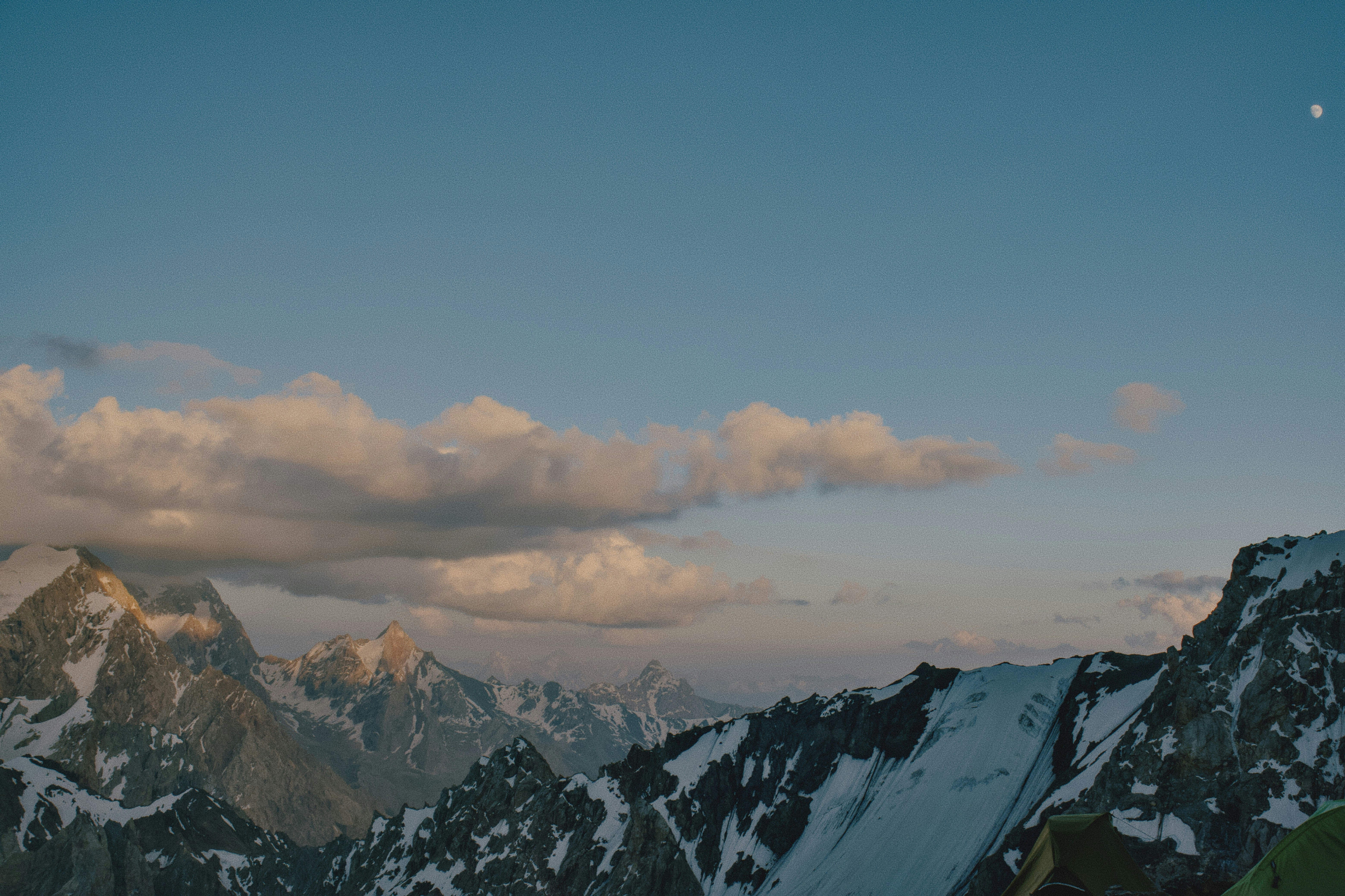 Distant Peaks under a Clear Sky with a Tent Veil of Snow