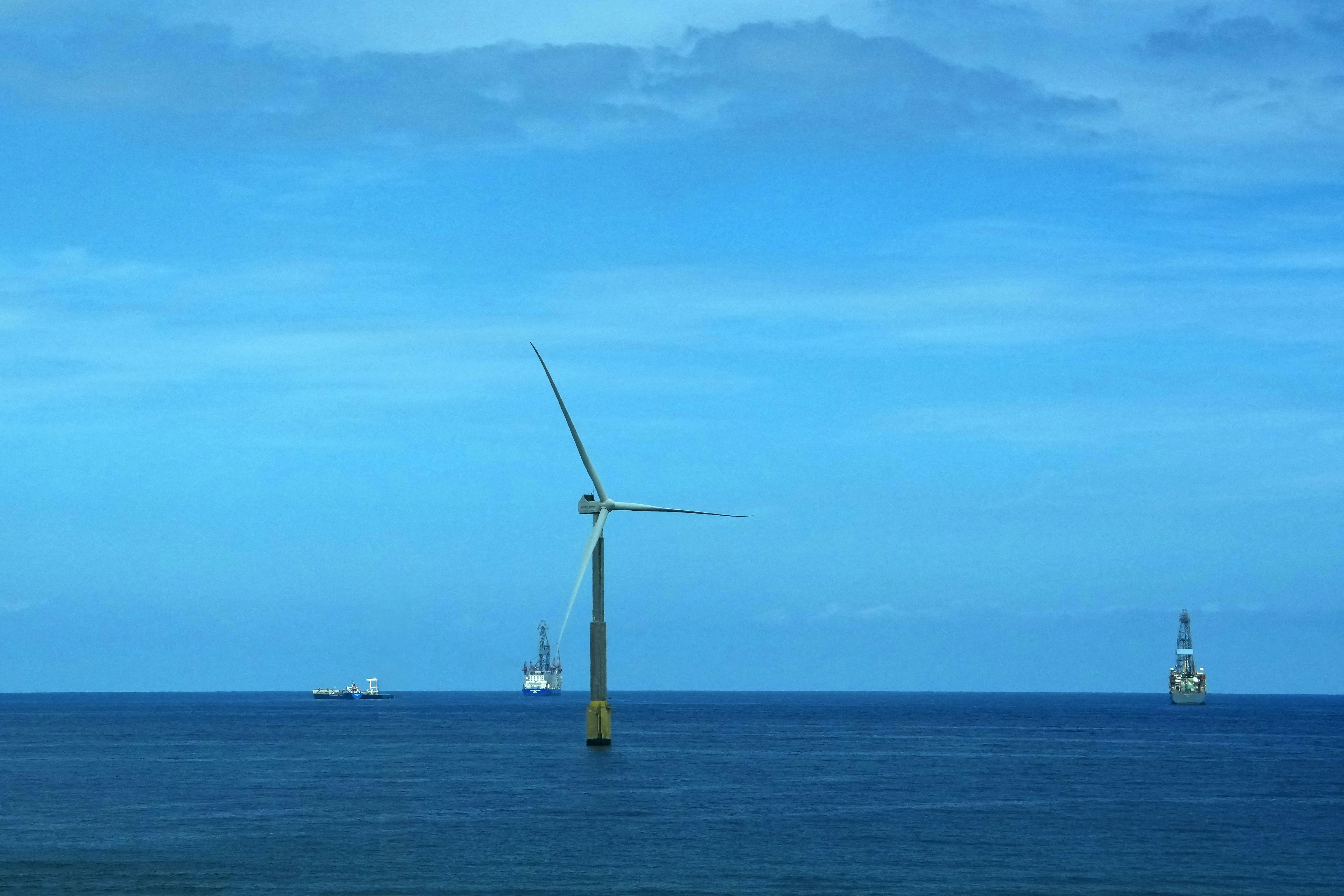 Single Turbine Sentinel Above a Quiet Sea