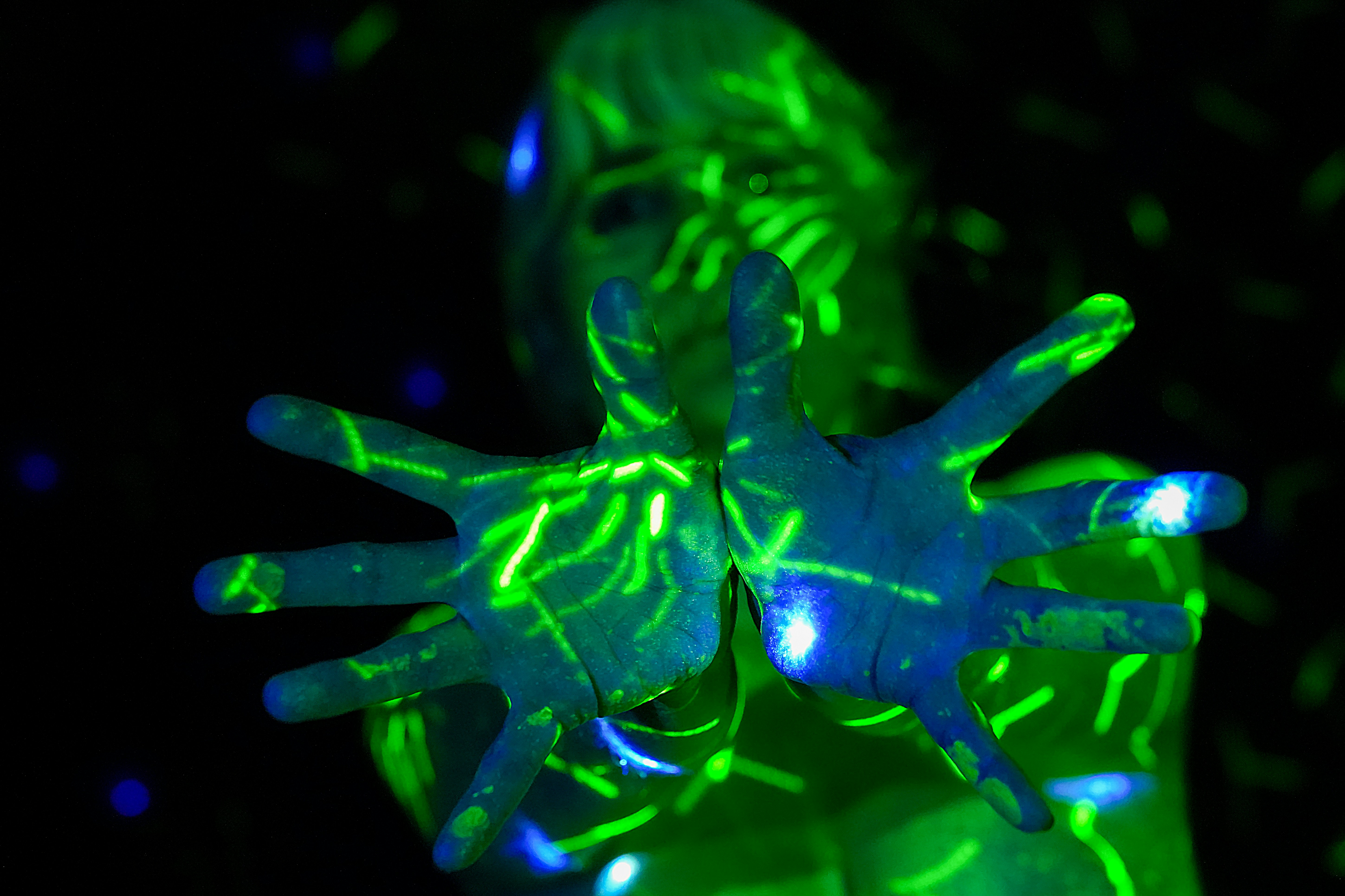Glowing Hands Reaching Through a Neon Veil