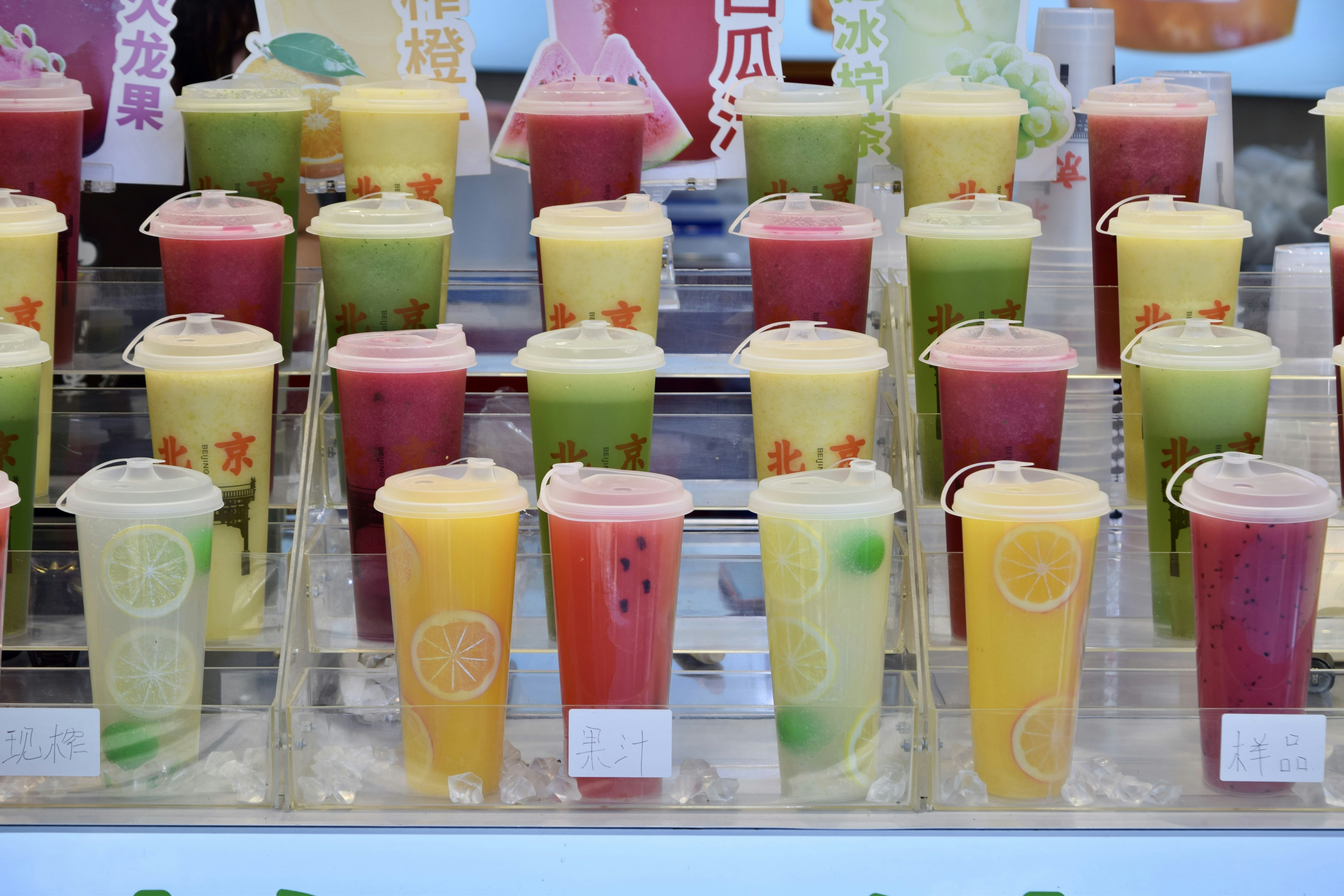 Rainbow Bubbles: A Row of Lemon-Lime Slushies on Display