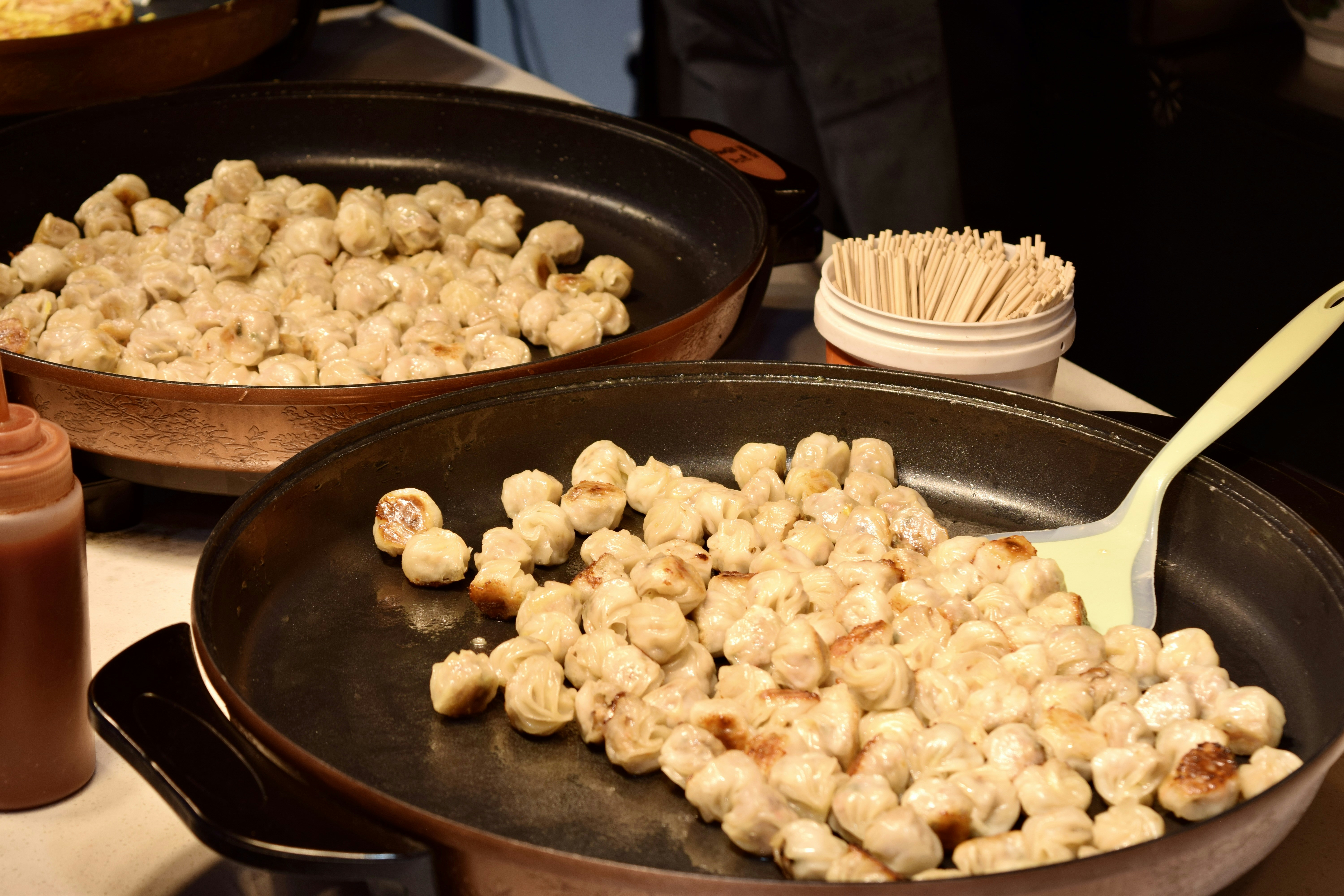 Skillet Corners: Savory Chicken Bites Sizzle at a Buffet Prep Station