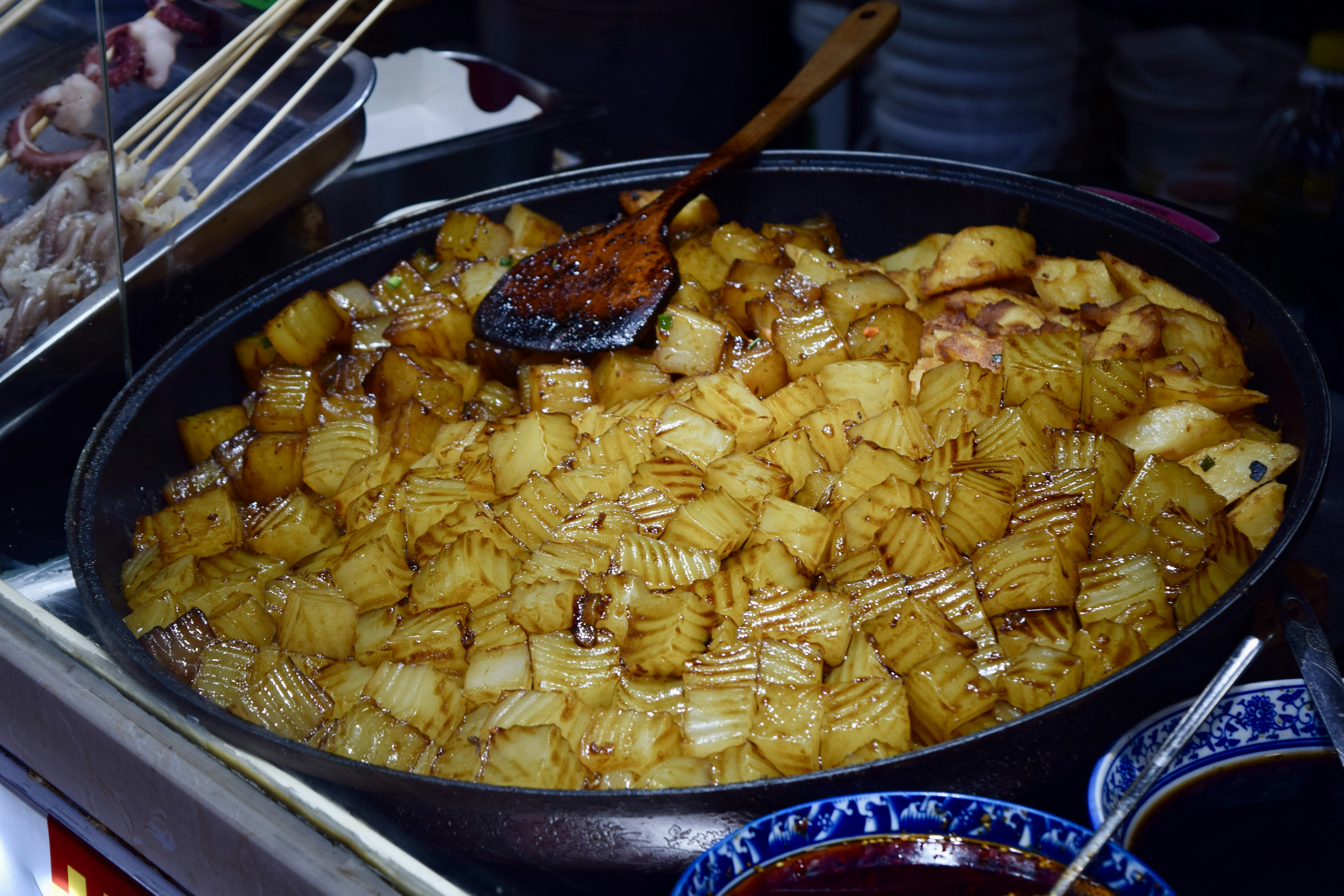Crisped Potatoes in a Skillet: Golden Glaze at a Food Market