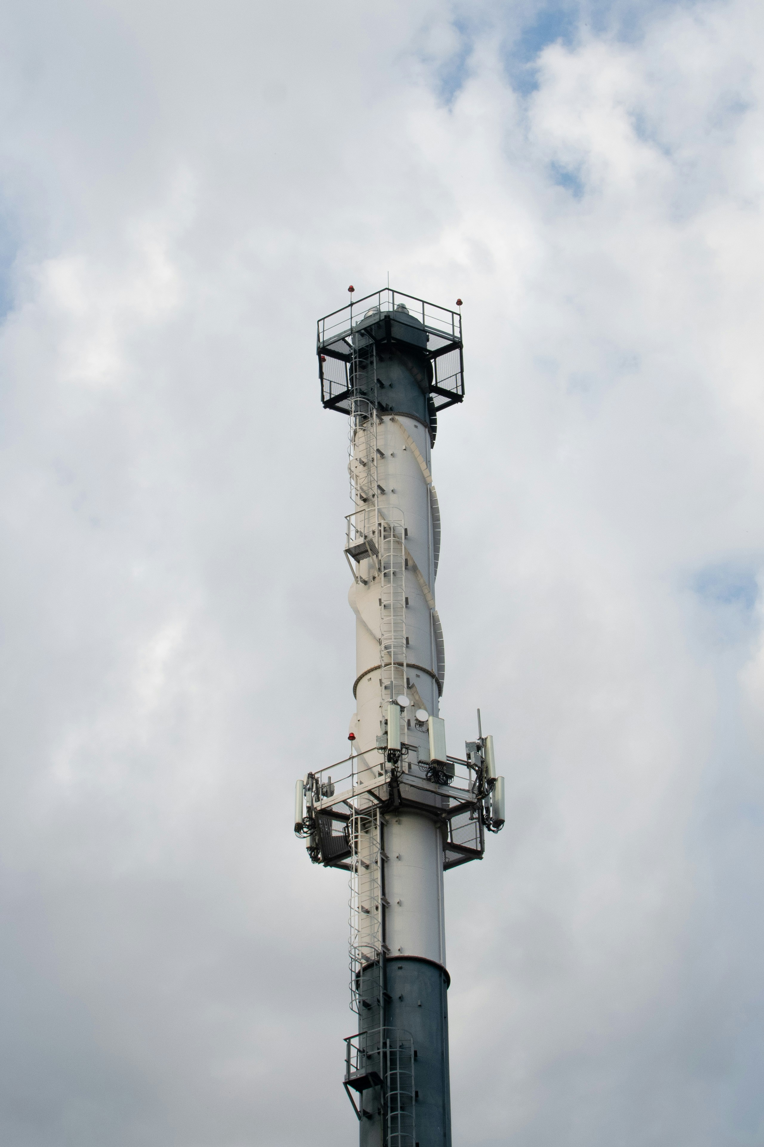 Steel Sentinel: A Chimney of Signals Reaching the Sky