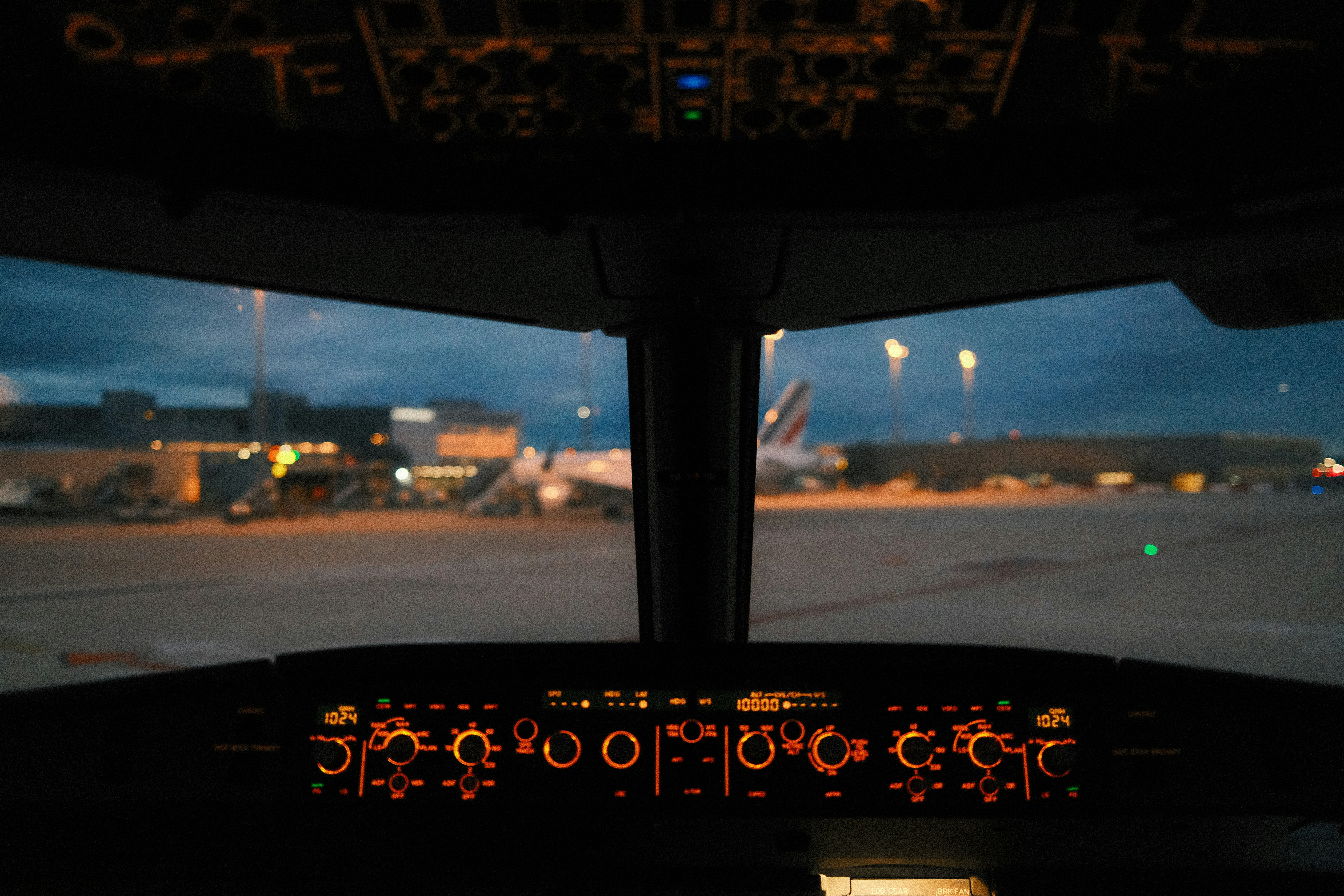 Cockpit Lights: Evening runway through the cockpit windows