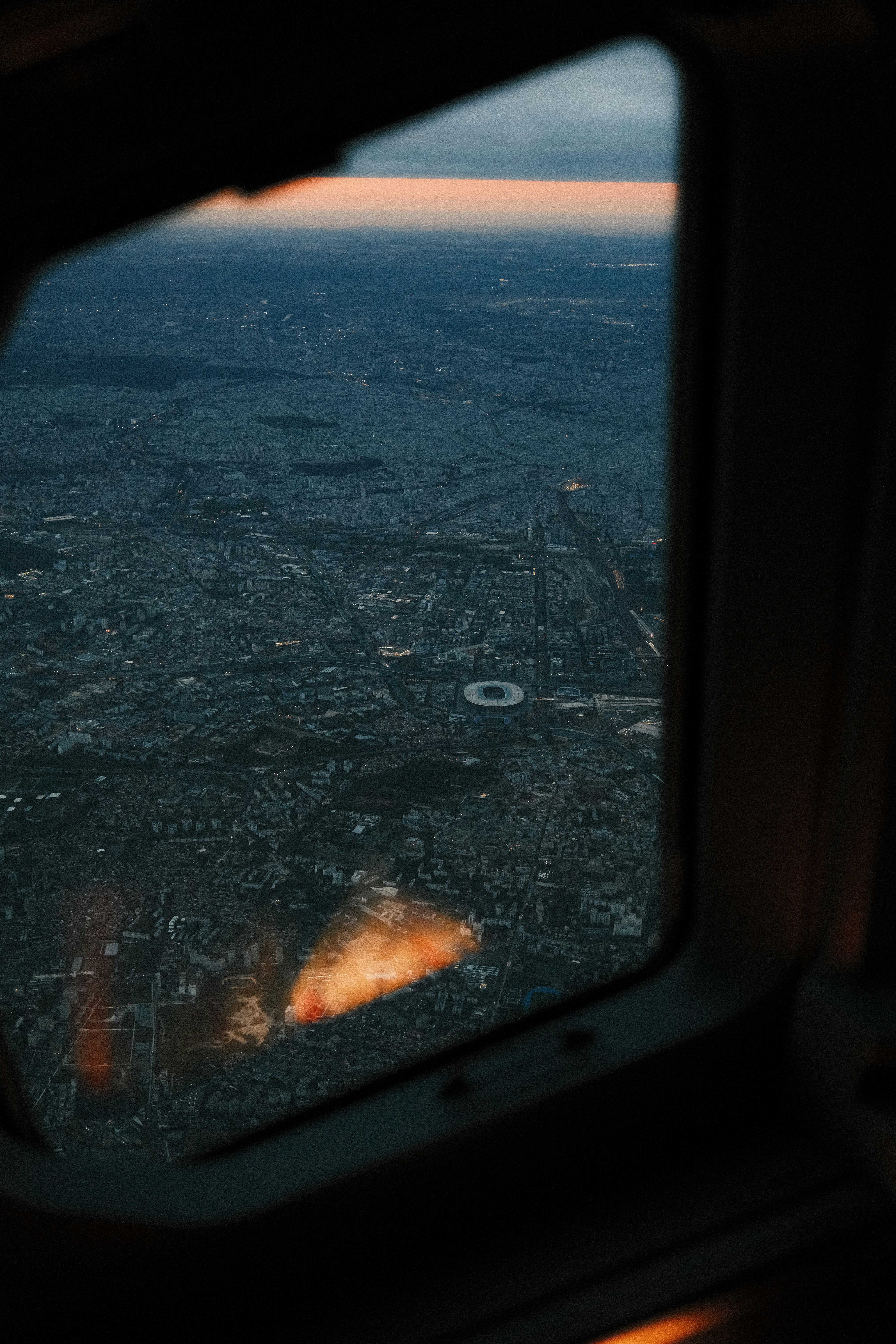 Window to a Winter City: Aerial Dusk Over a Dotted Metropolis