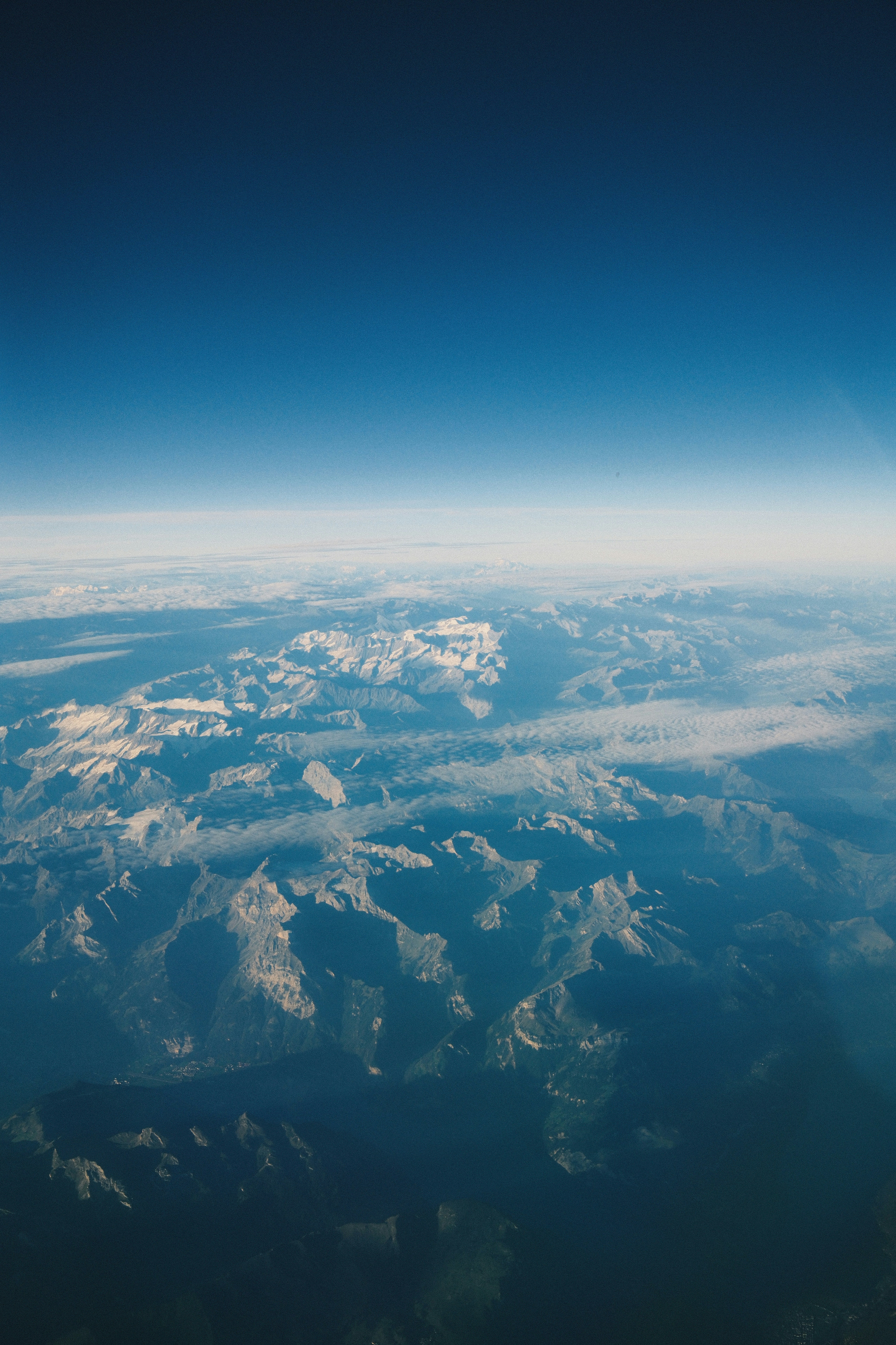 Above the Pillows of Snow: Aerial Summit over the Alps at Dawn