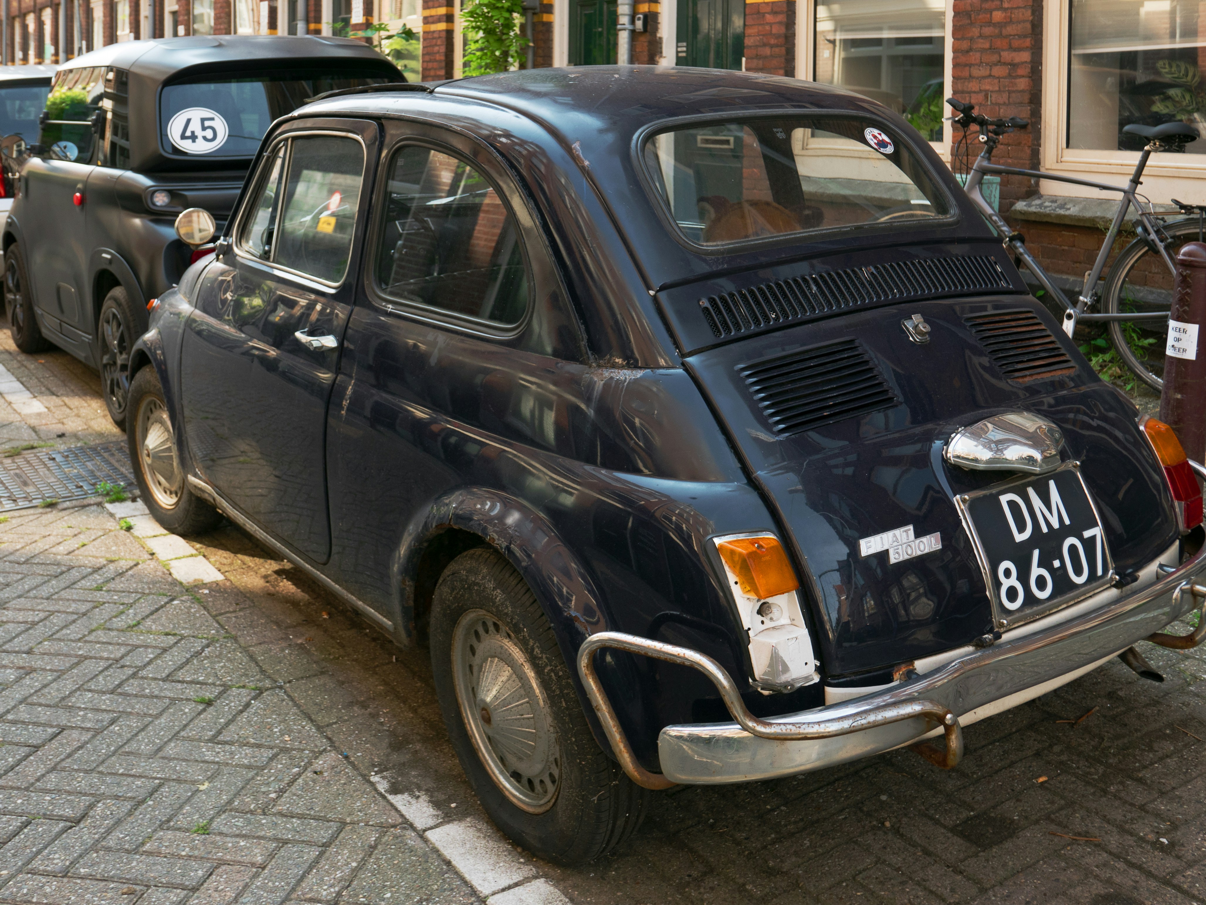 Vintage Dutch Fixture: A Classic Fiat Quietly Anchoring a Quiet Street