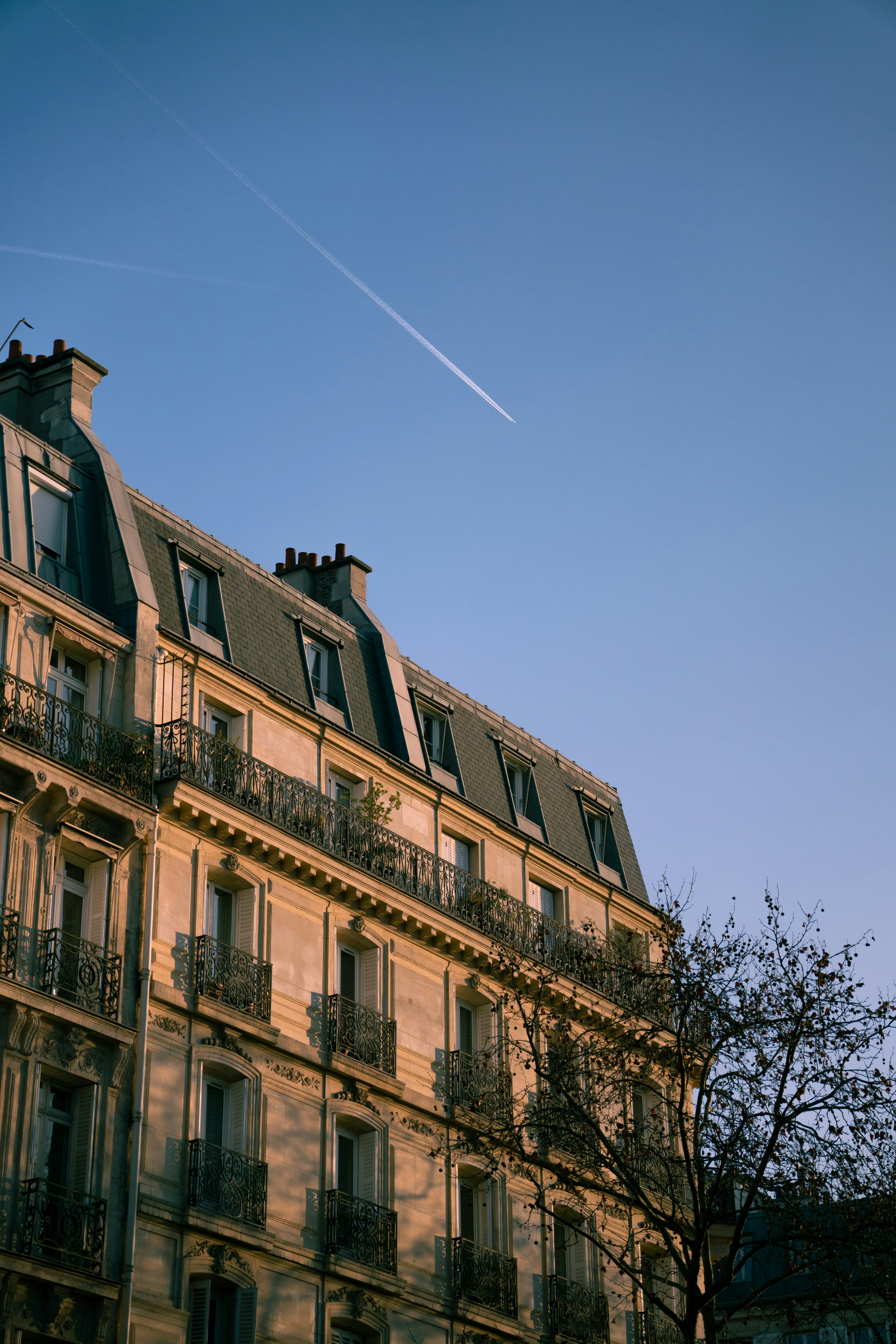 City Facade at Dusk with a Sky-trail