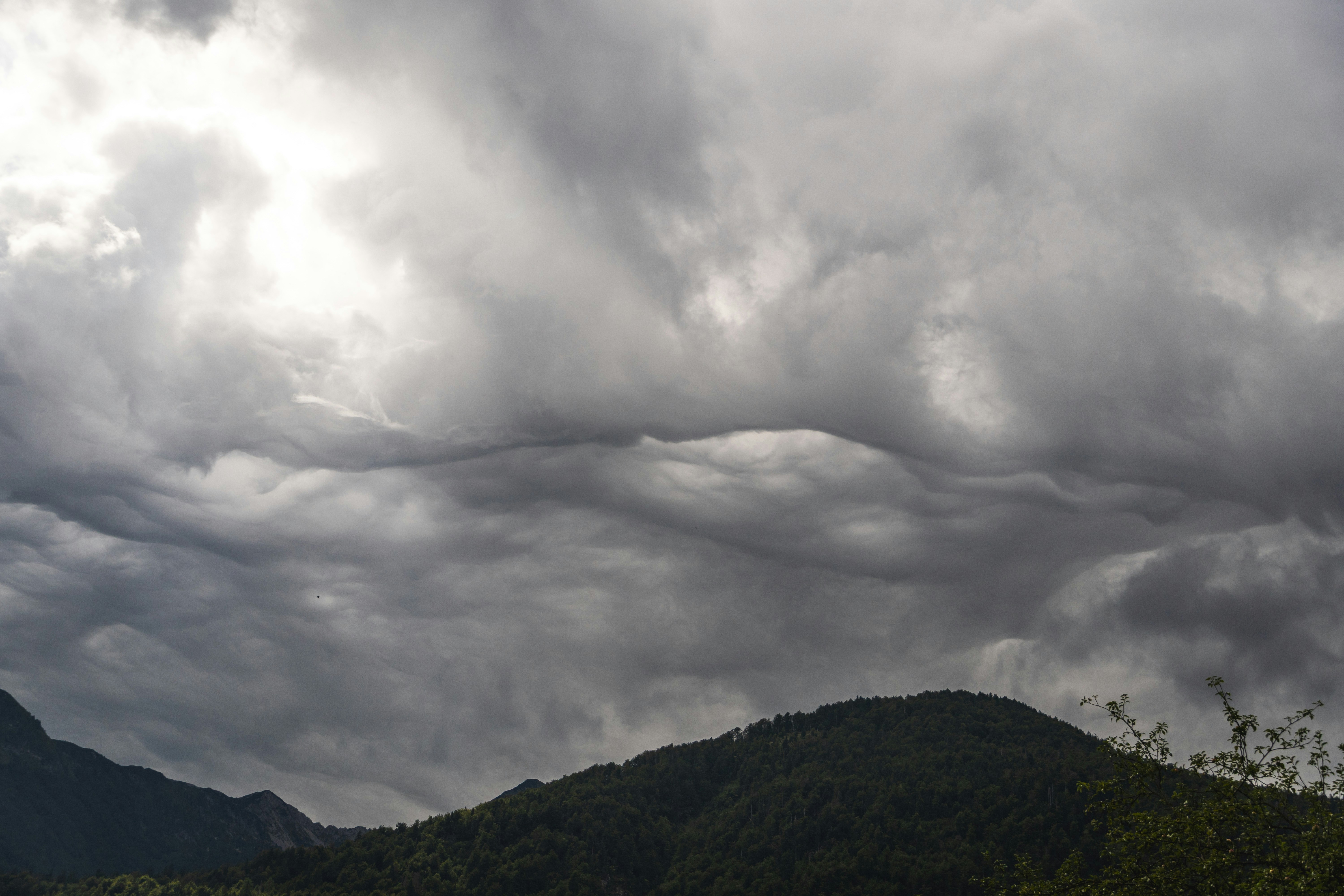 Storm-Driven Rise: A Cloudfront Over the Mountain Crest