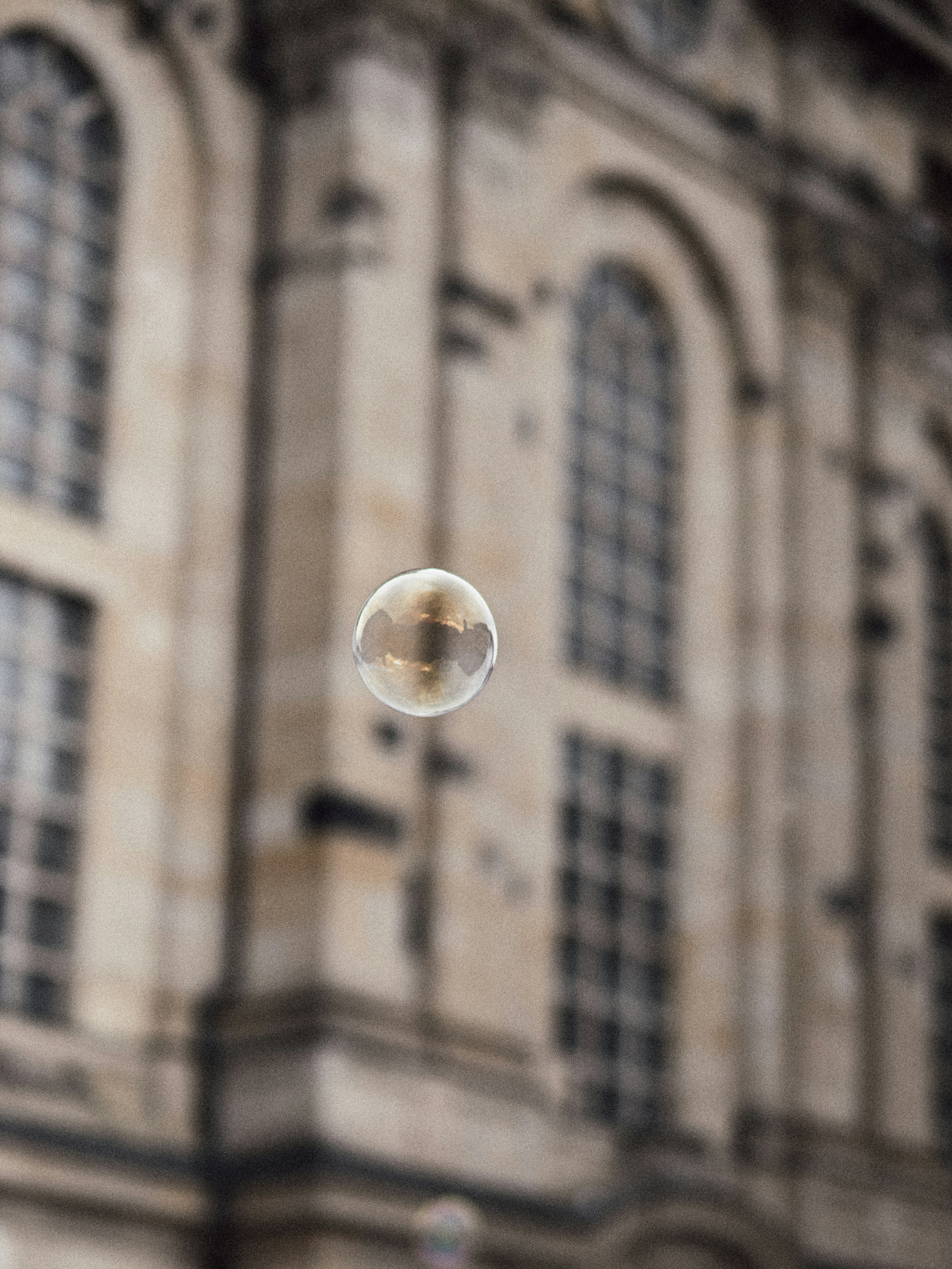 Floating Sphere Above a Historic Facade