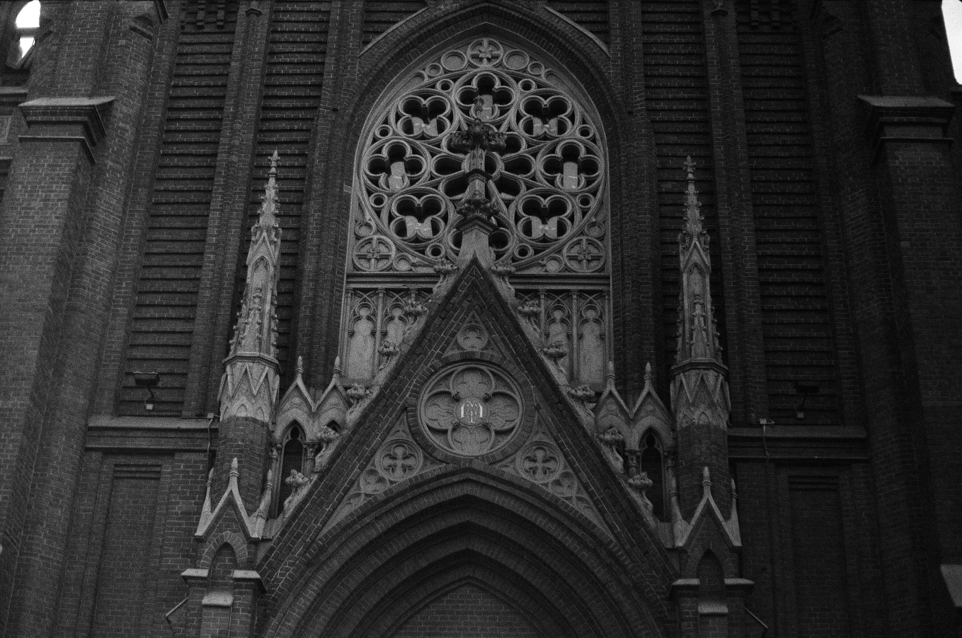 Gothic Facade in Low Light: A Window to Stone Symmetry