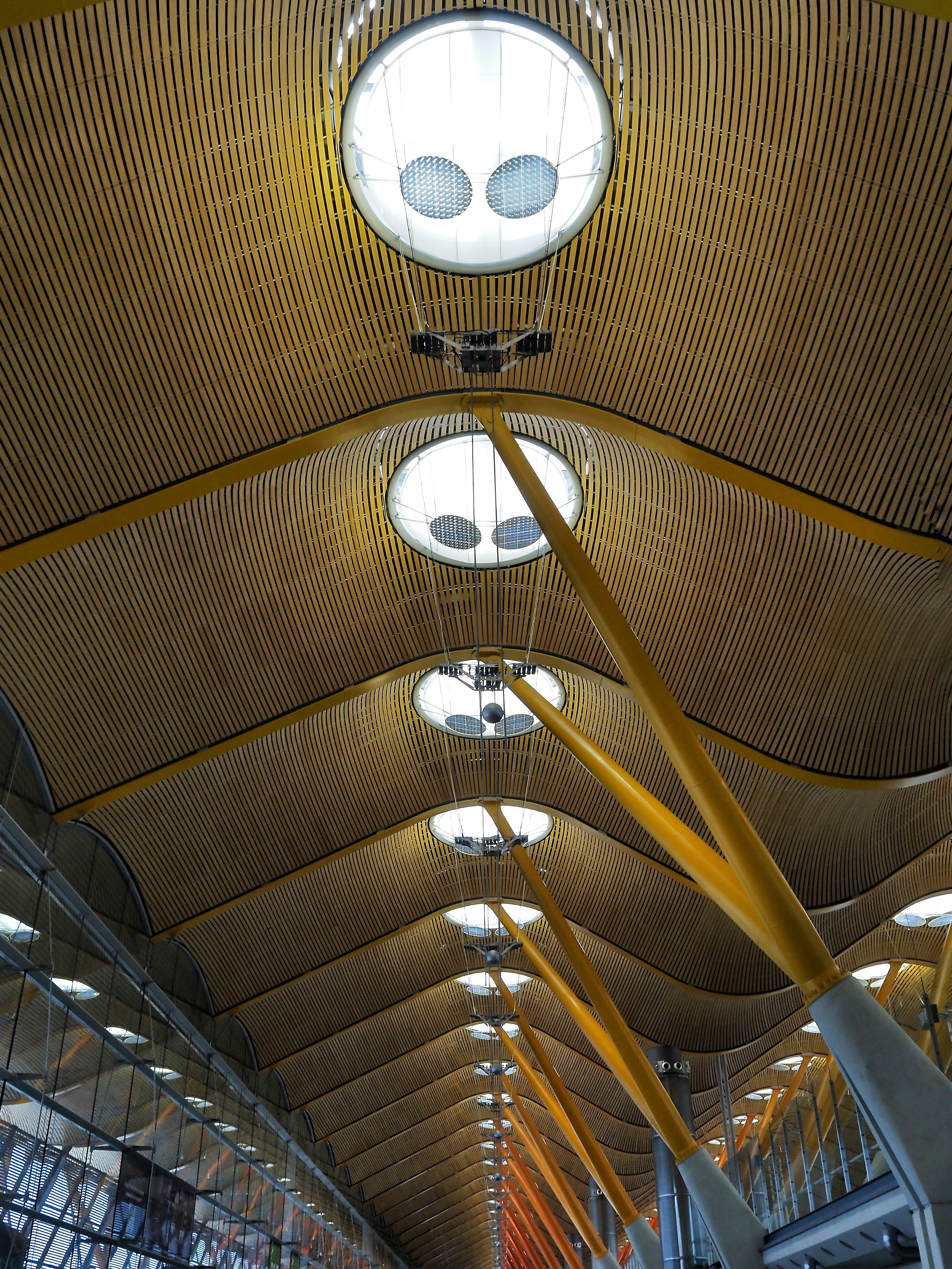 Golden Arches: A Barrel-arched Walkway under Yellow Beams