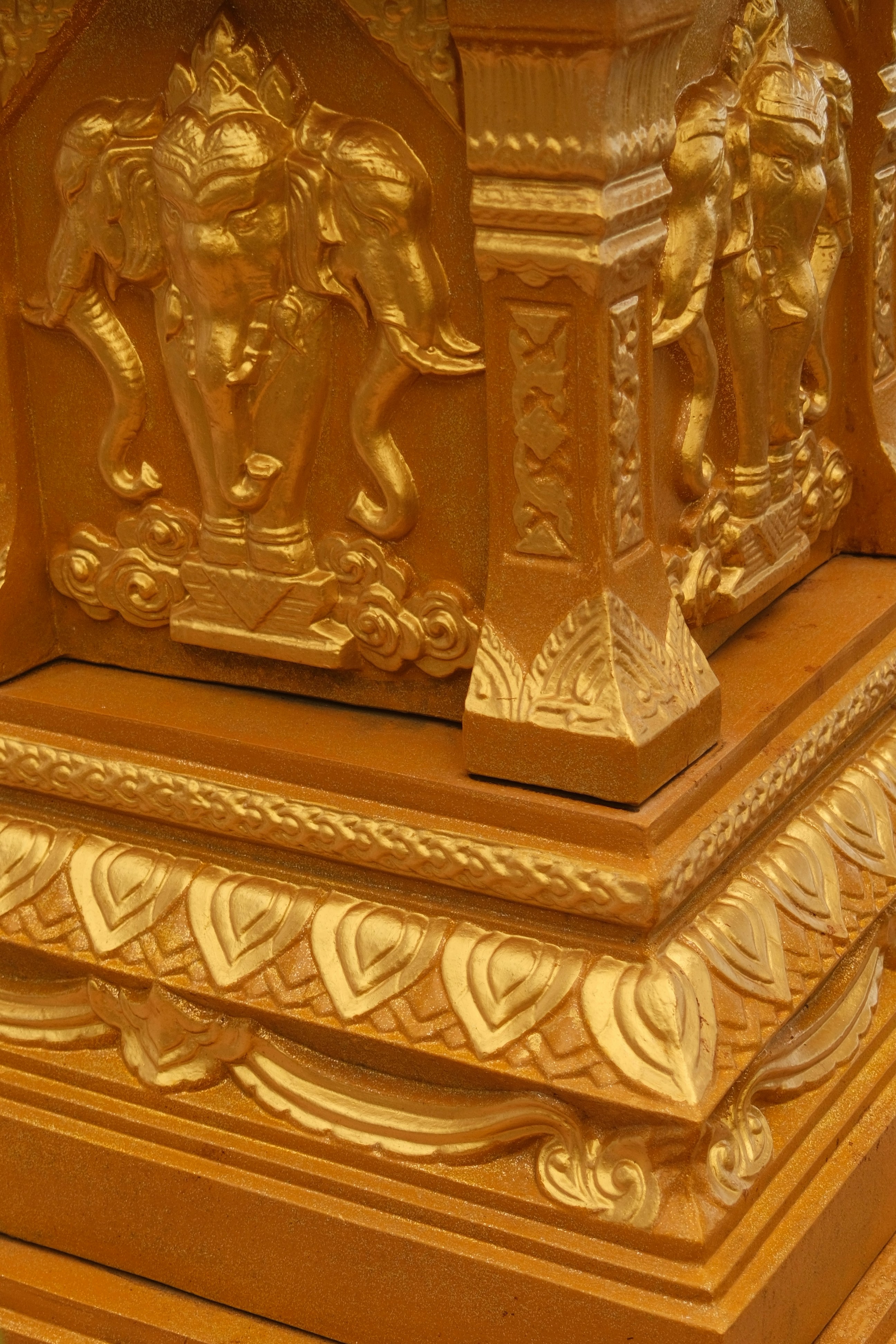 Golden Carved Monumental Base in Warm Toned Detail