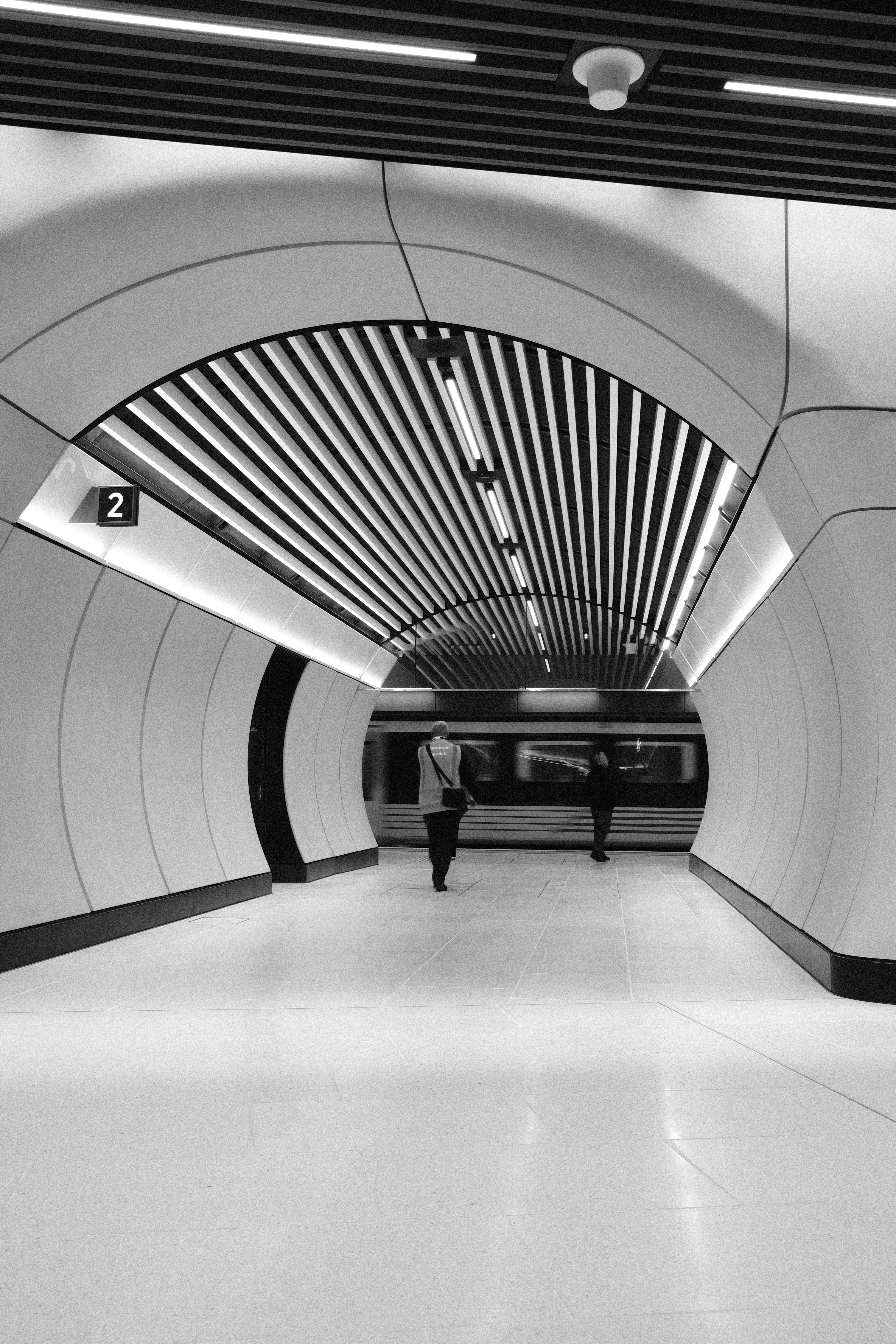 Symmetric Transit: A Monochrome Archway to the Platform