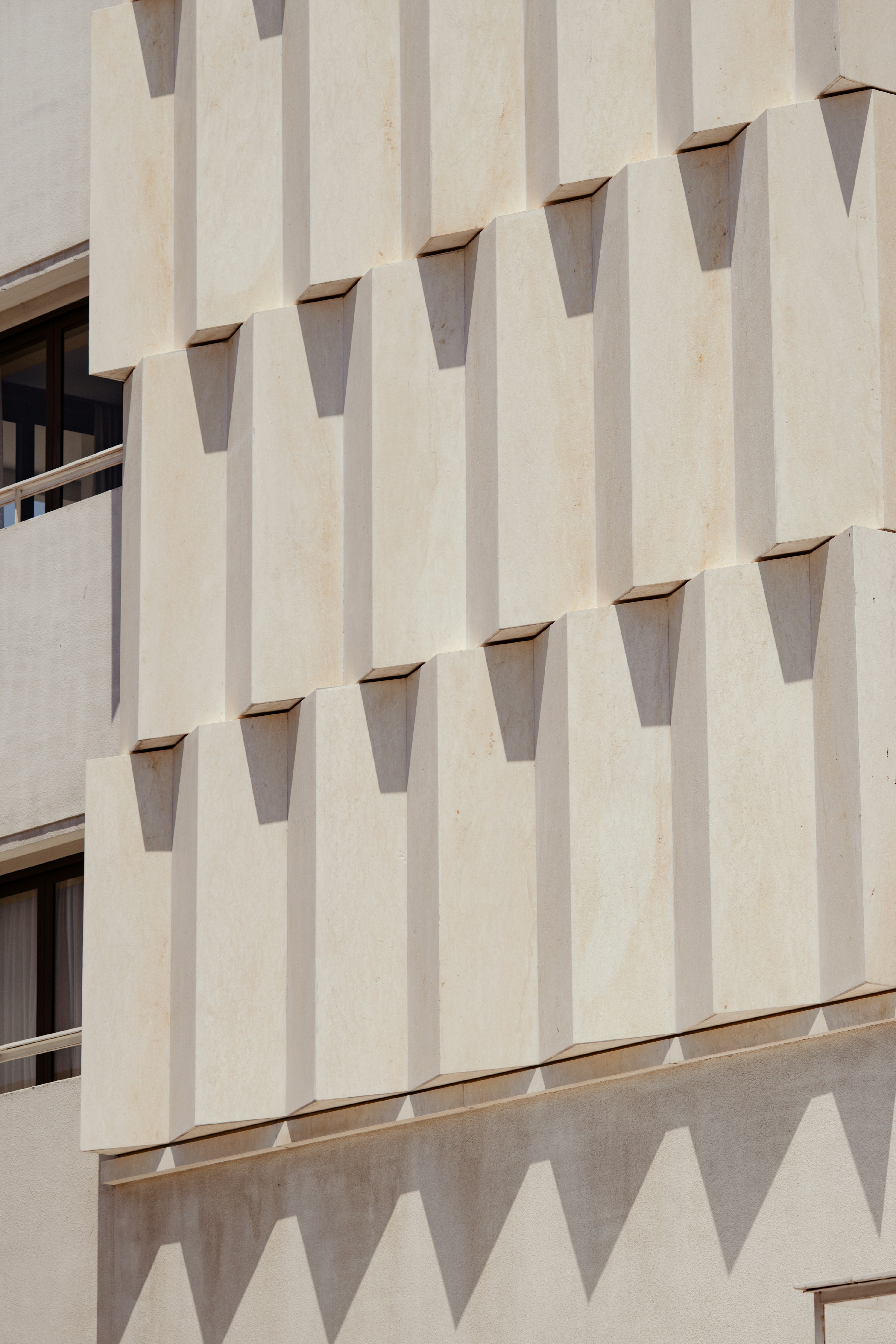 Geometric Facade: Repeating Shadows on a Sunlit Wall