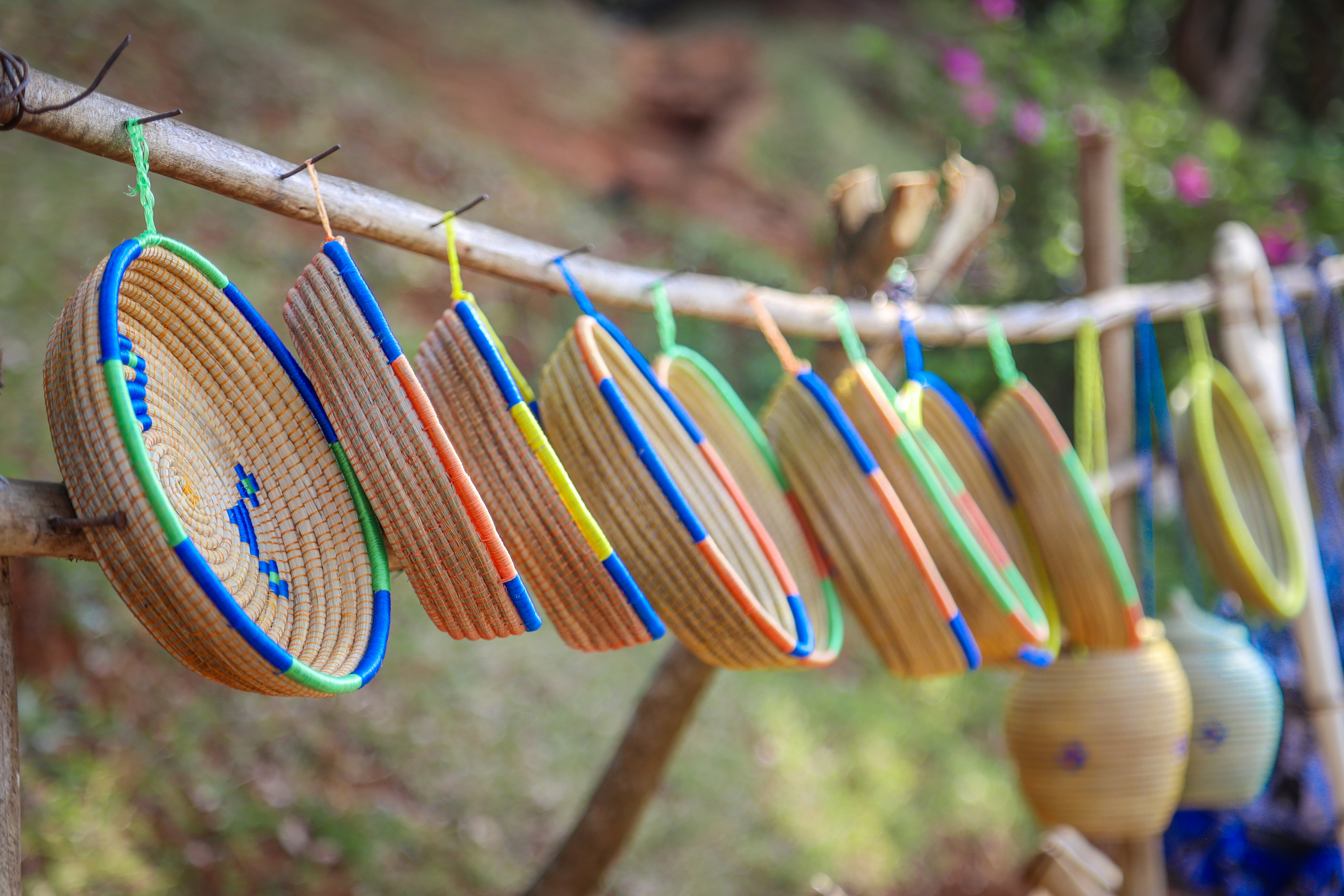 Colorful Woven Discs on a Rustic Line