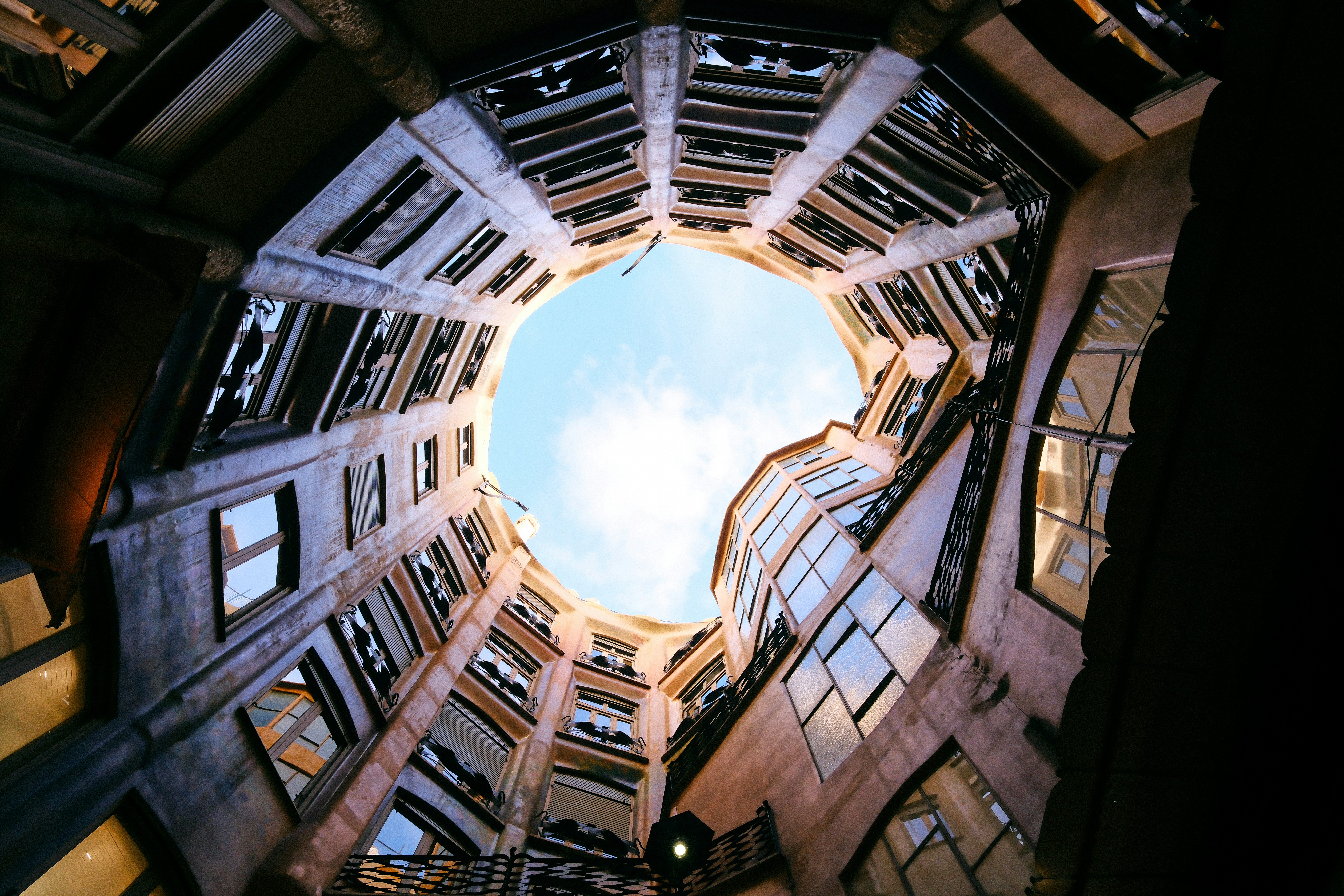 Skyward Atrium: Urban Canyon Reaching for Daylight