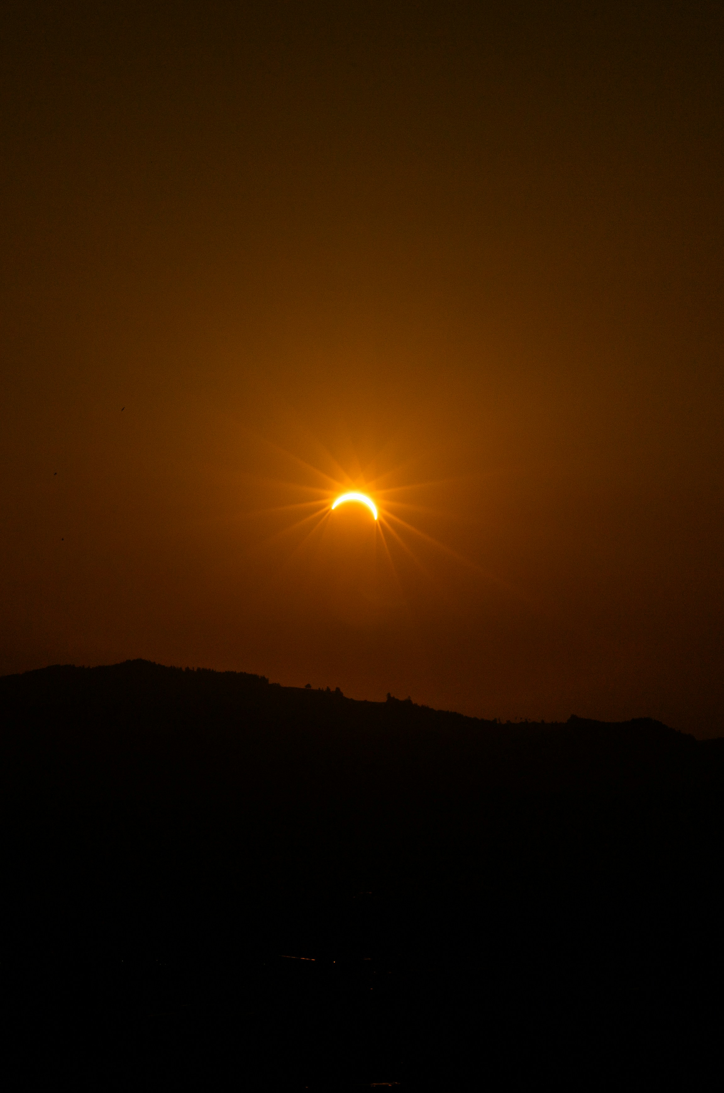 Crescent Sunrise: Minimal Horizon with Solar Flare