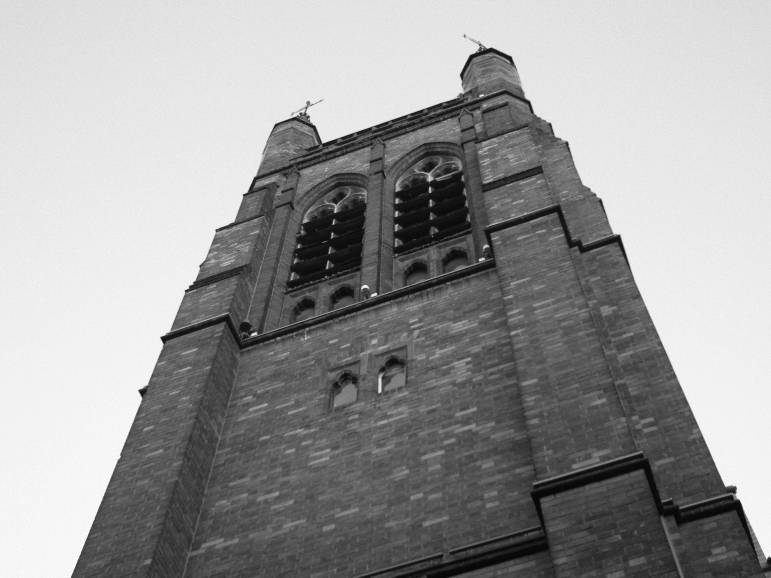 Towering Brick BellTower Reaching Toward the Sky