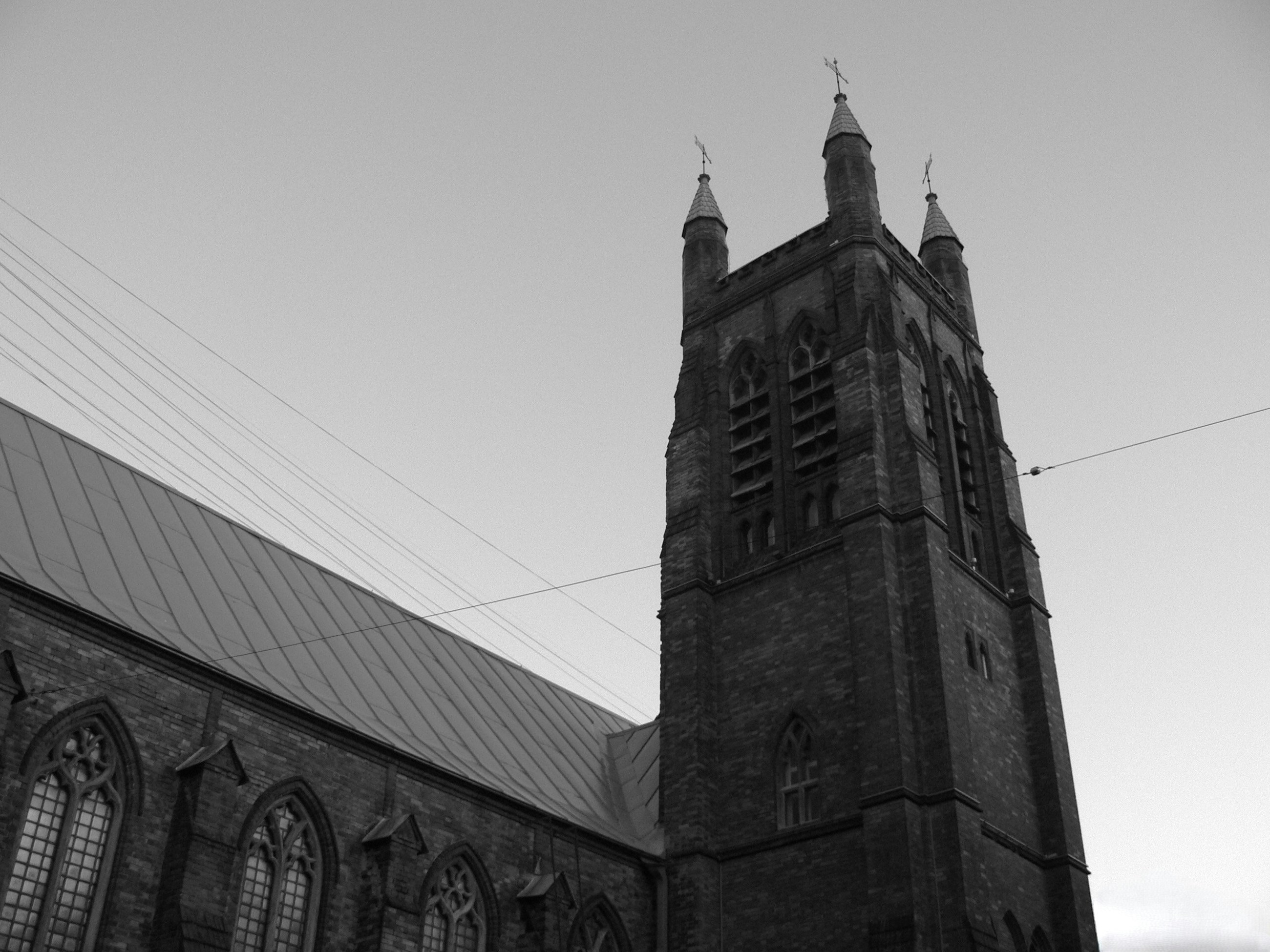 Gothic Tower Against Sky: A Silent Cathedral in Mono