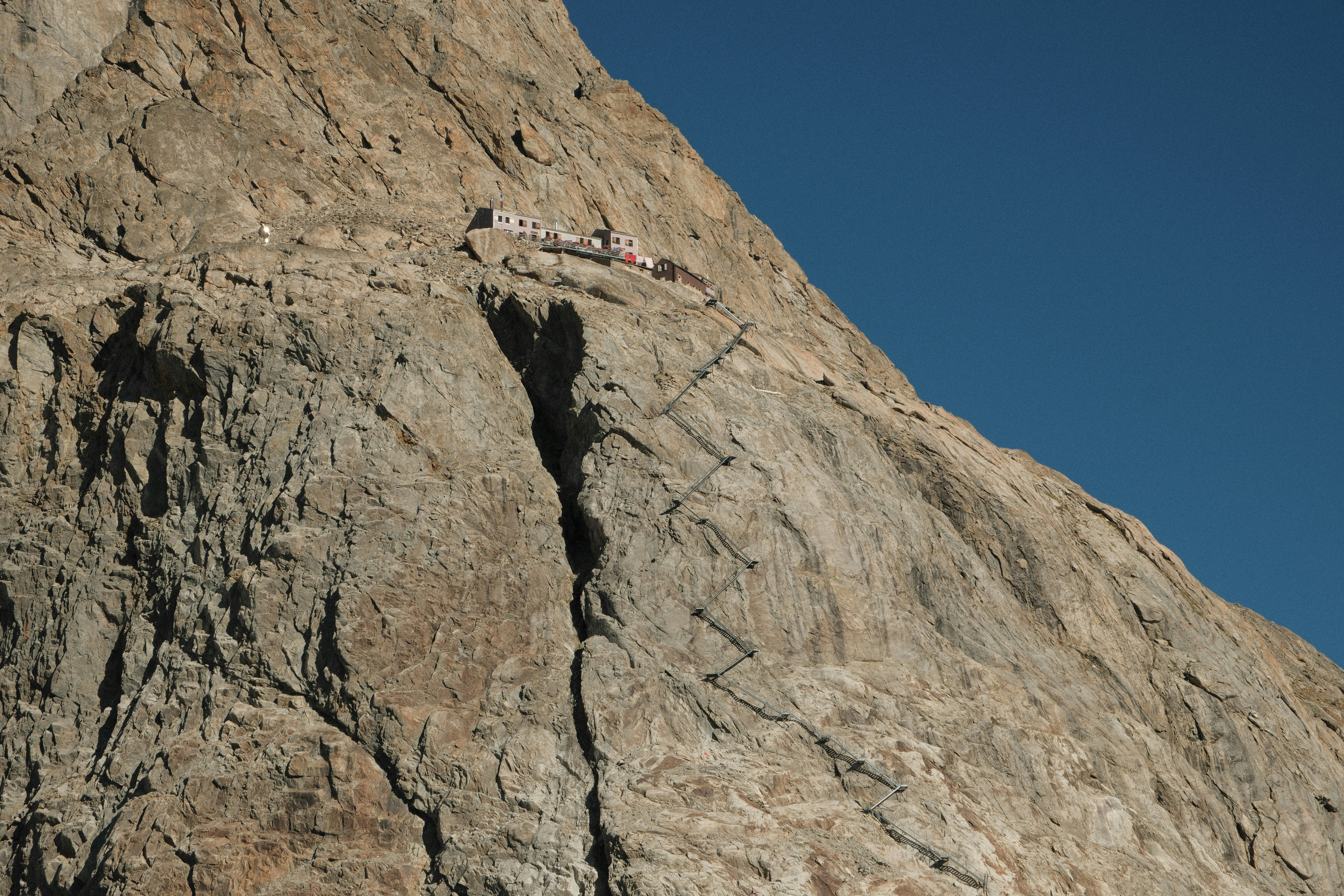 A Cliffside Alpine Hotel Clings to a Narrow Peak
