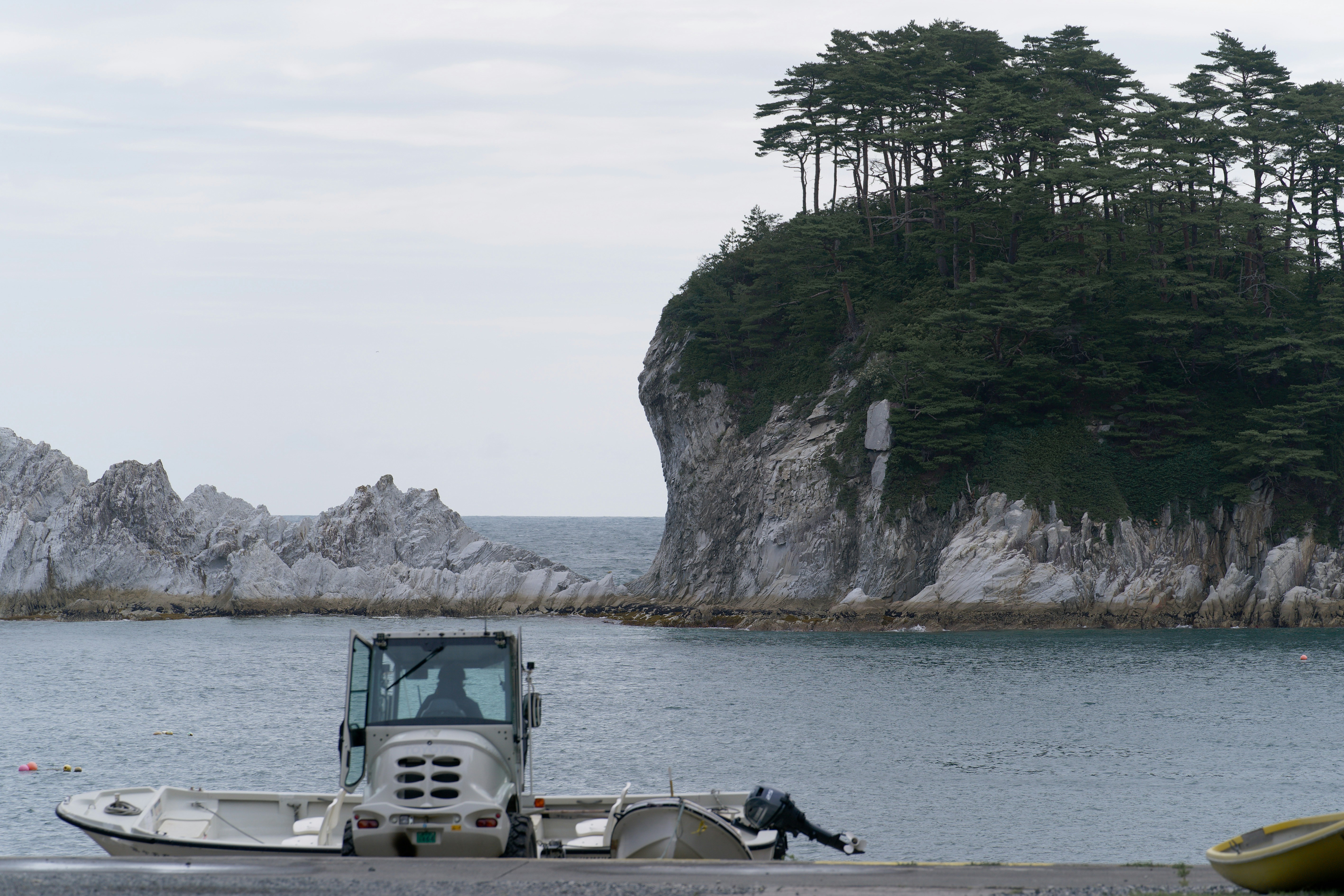 Boat at the Foot of a Cliffed Isle
