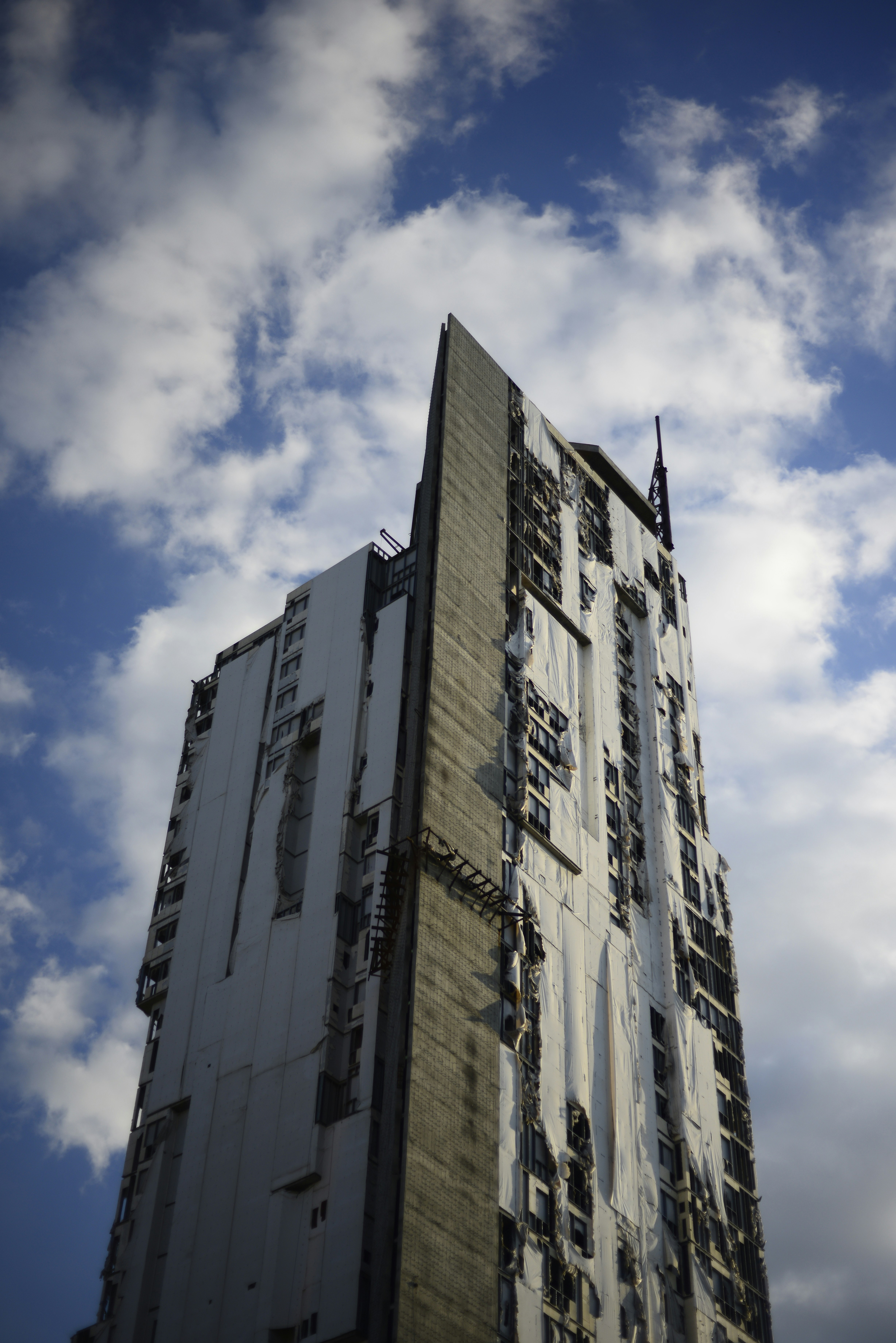 Skyward Reliquary: A Weathered High-rise Reaching for the Sky