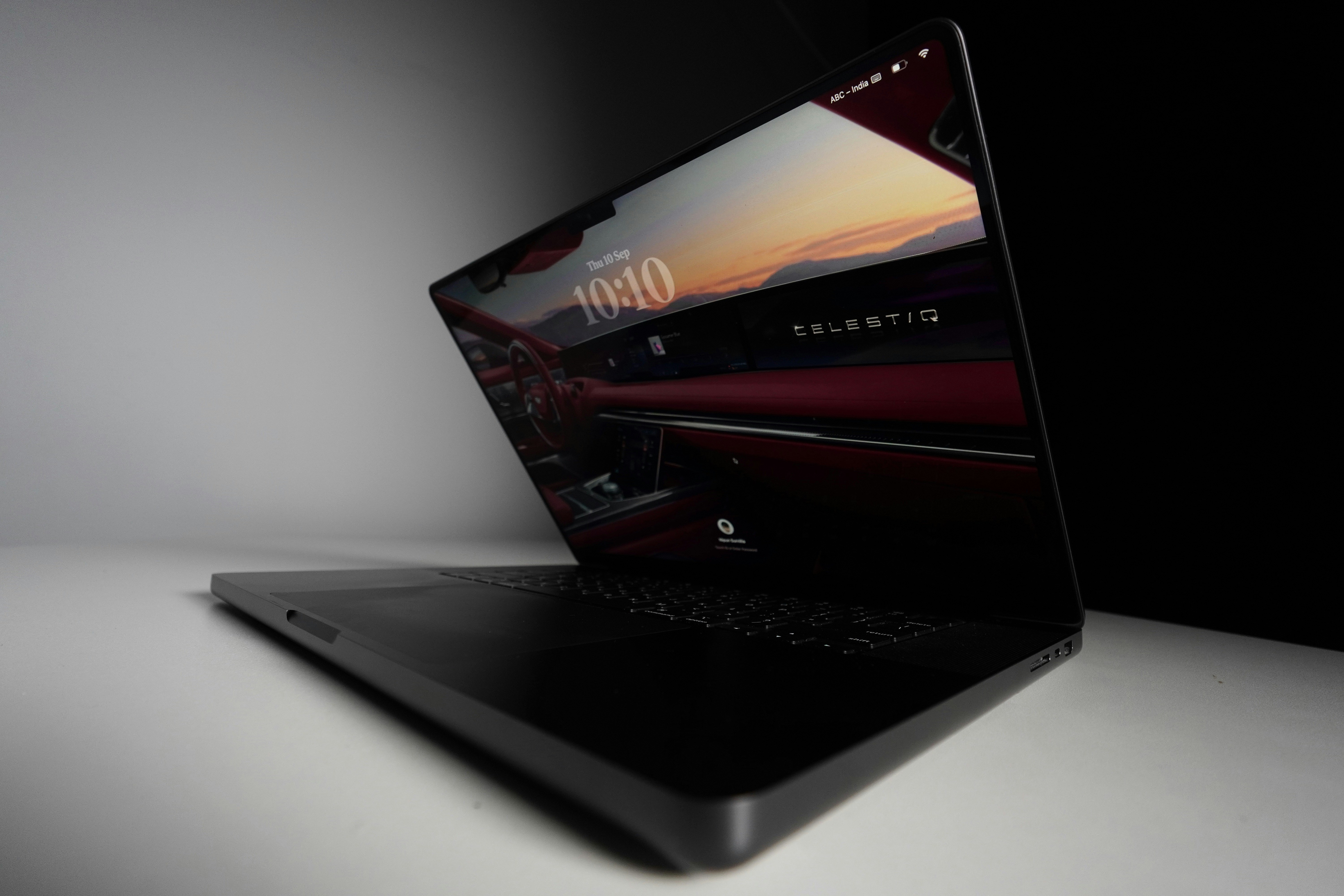 Tilted Notebook, Silent Studio: A Minimal Laptop Scene in Monochrome Light