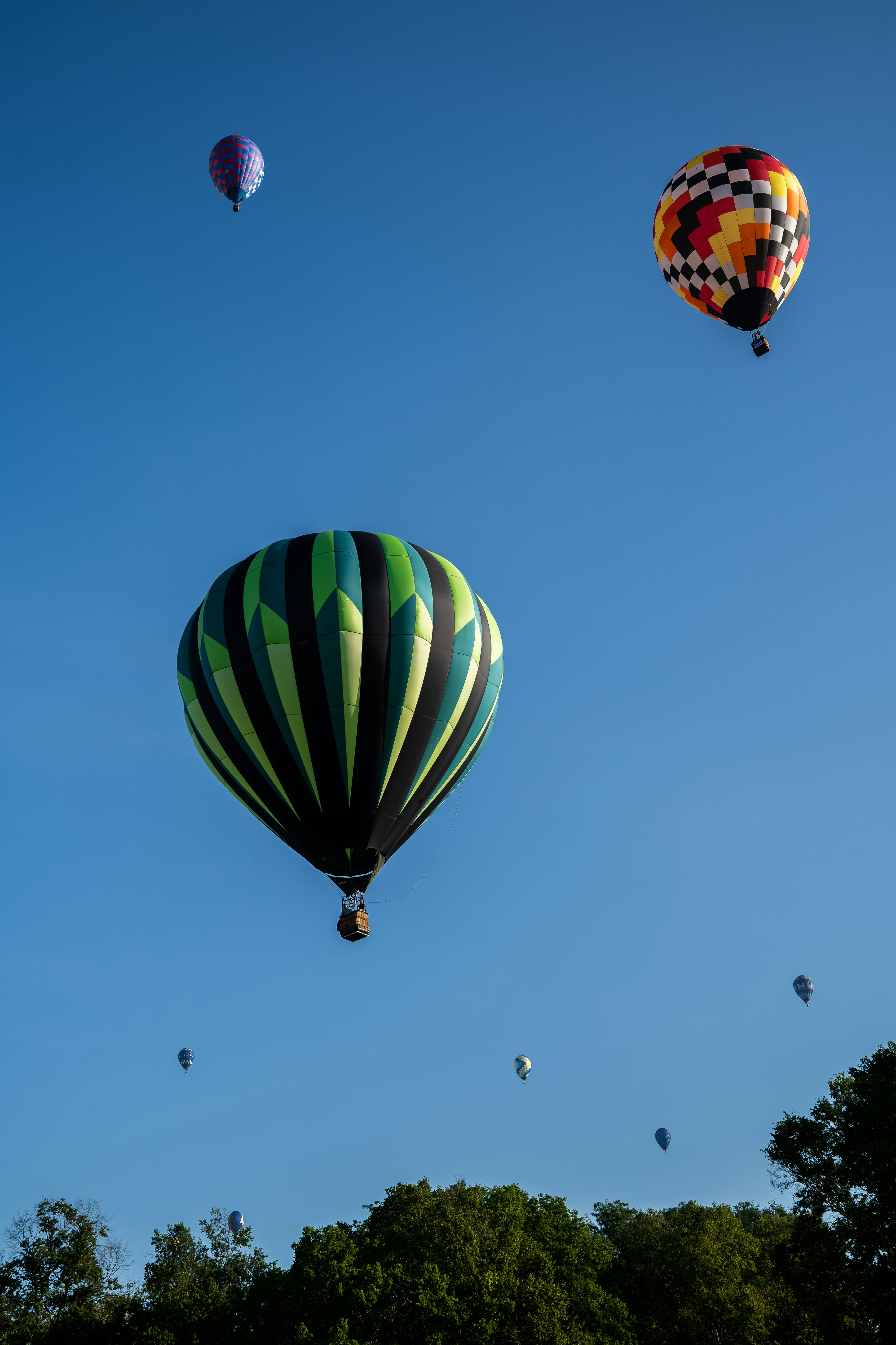 Triad of Giants: Bright Balloons Adrift Under a Crystal Sky