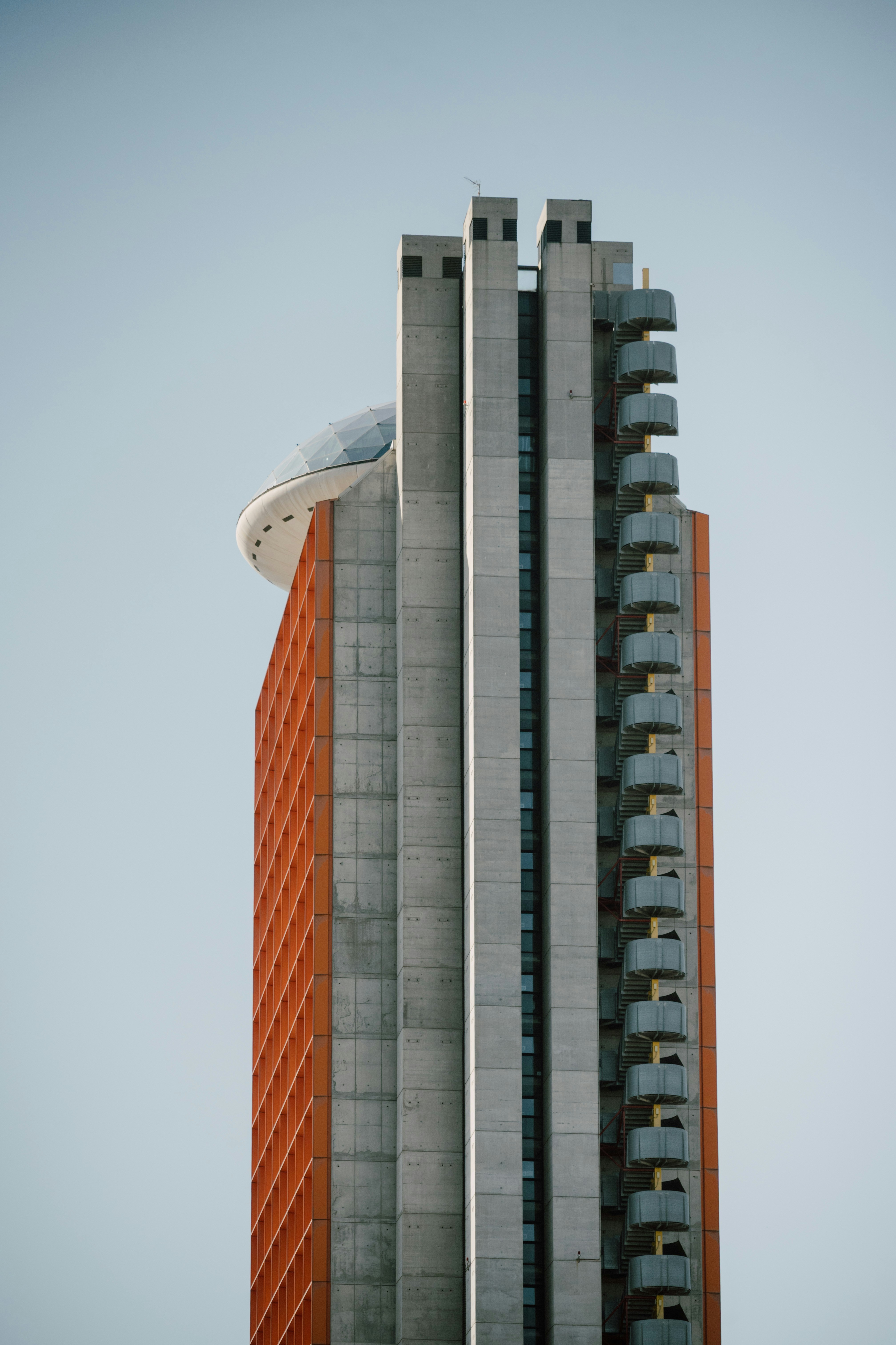 Vertical Concretescape: Arix Tower with Orange Facade