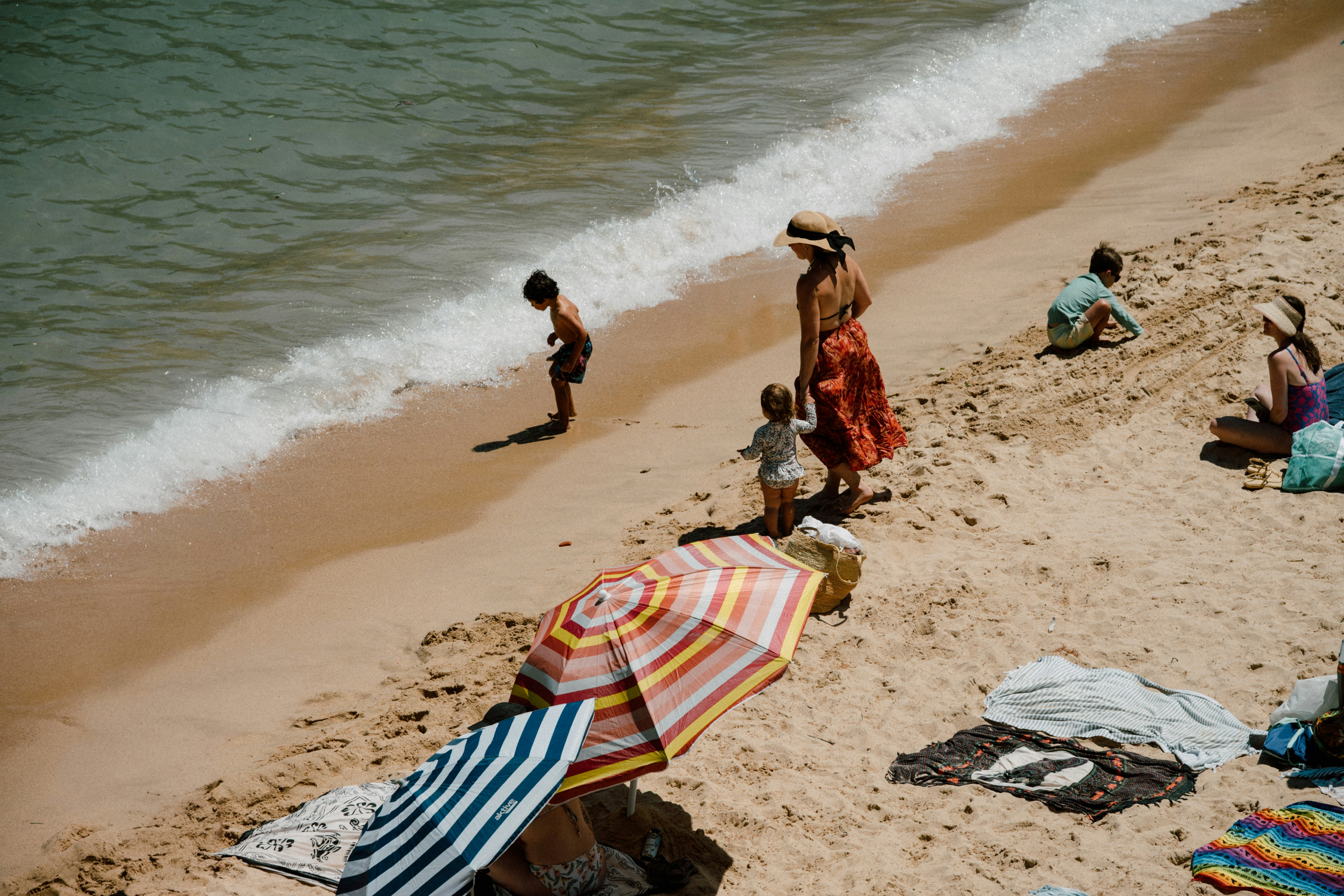 Beachside Family moments on sunlit shoreline