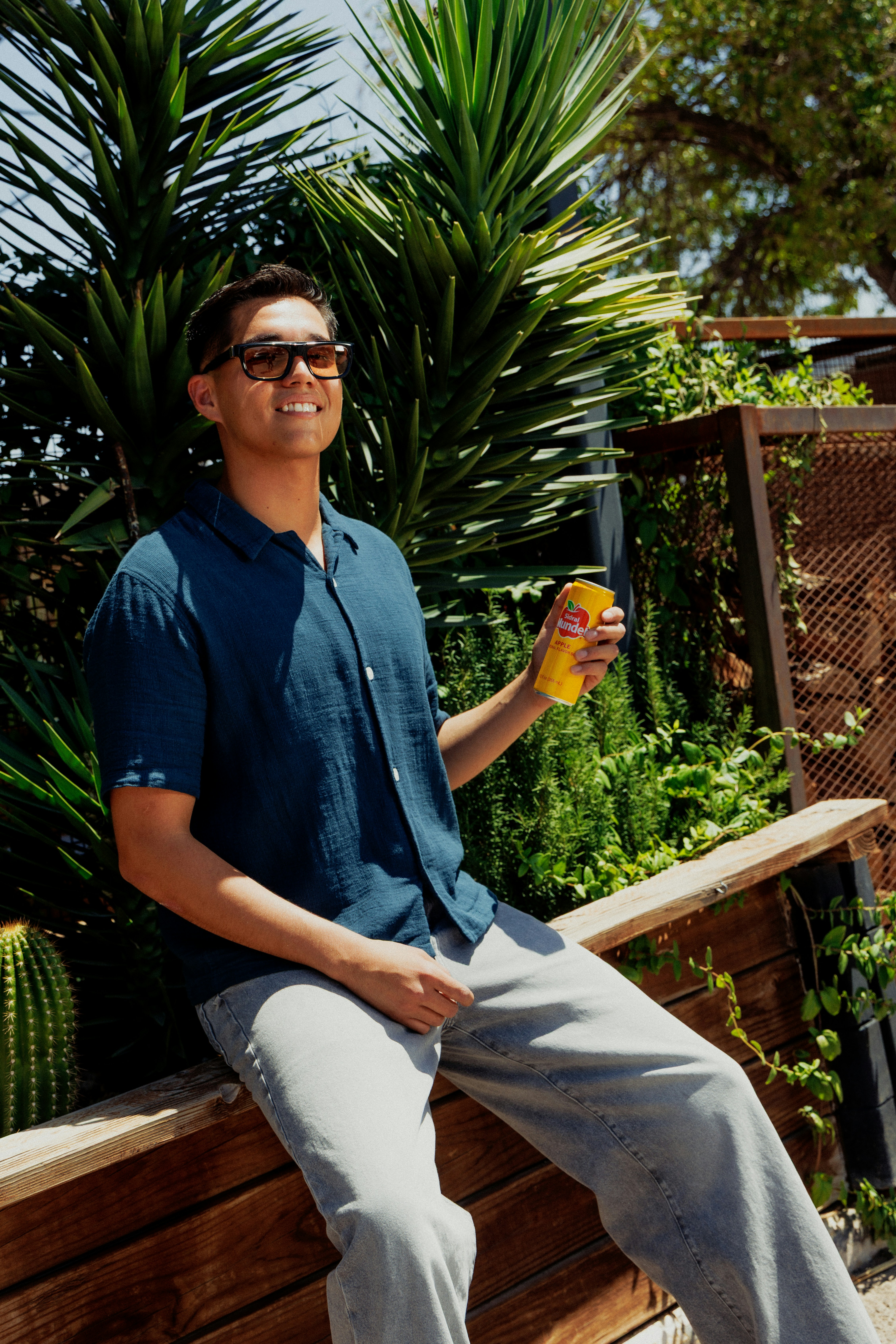 Sunlit Confidence: A Relaxed Moment with a Citrus Cup