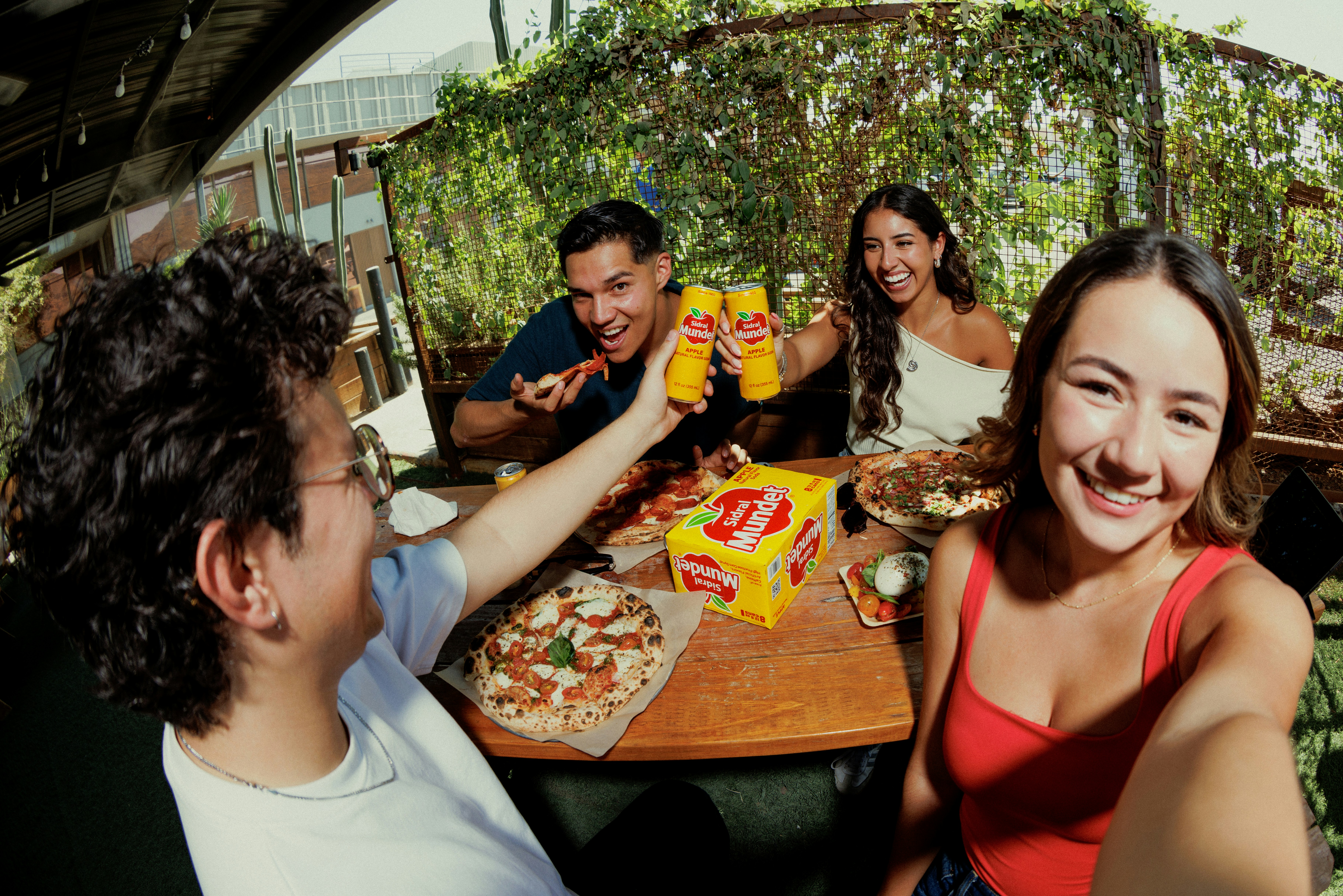 Cheerful Friends Raise a Pizzaloving Toast