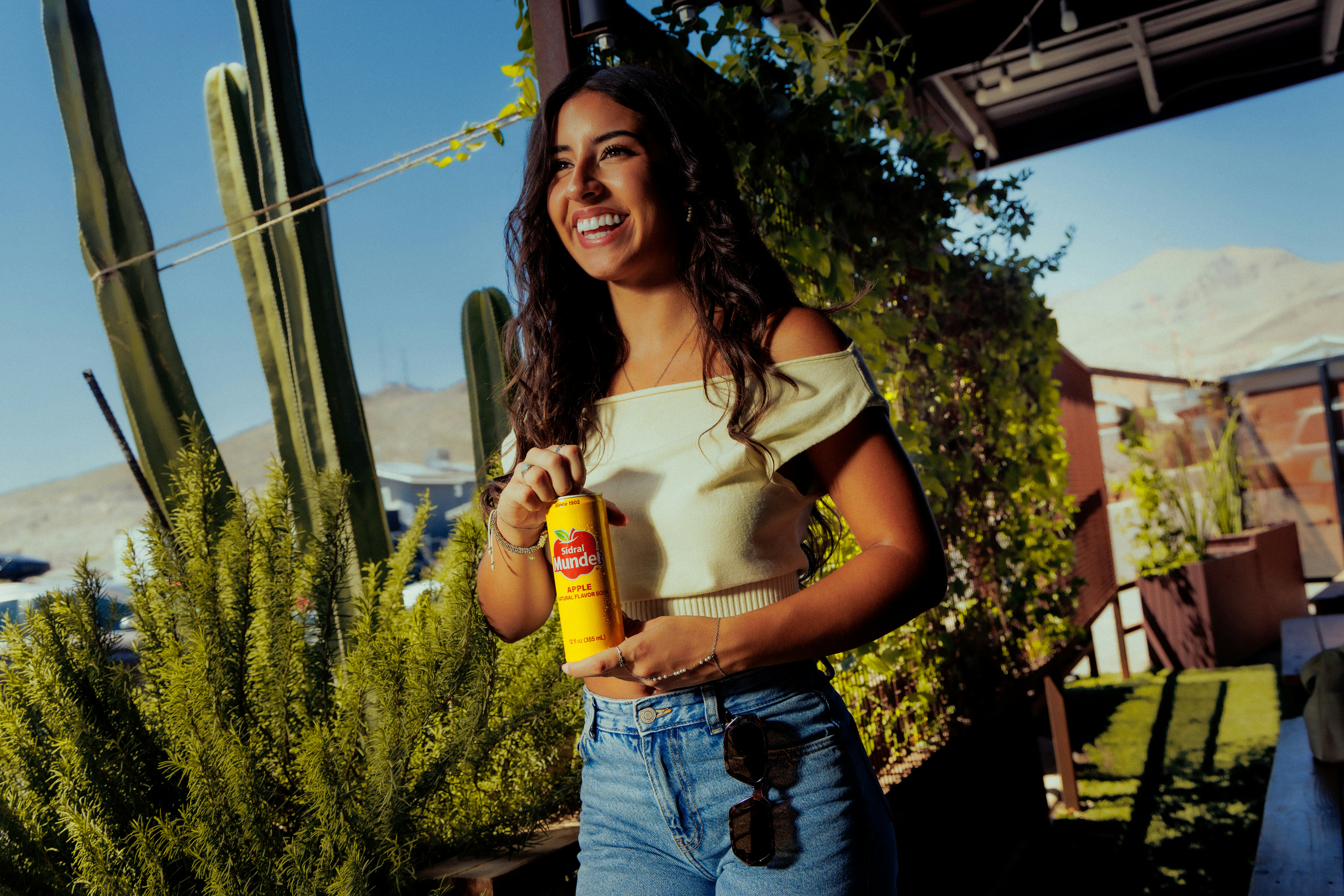 Sunlit smiles: a sunny moment with a bottle in the yard
