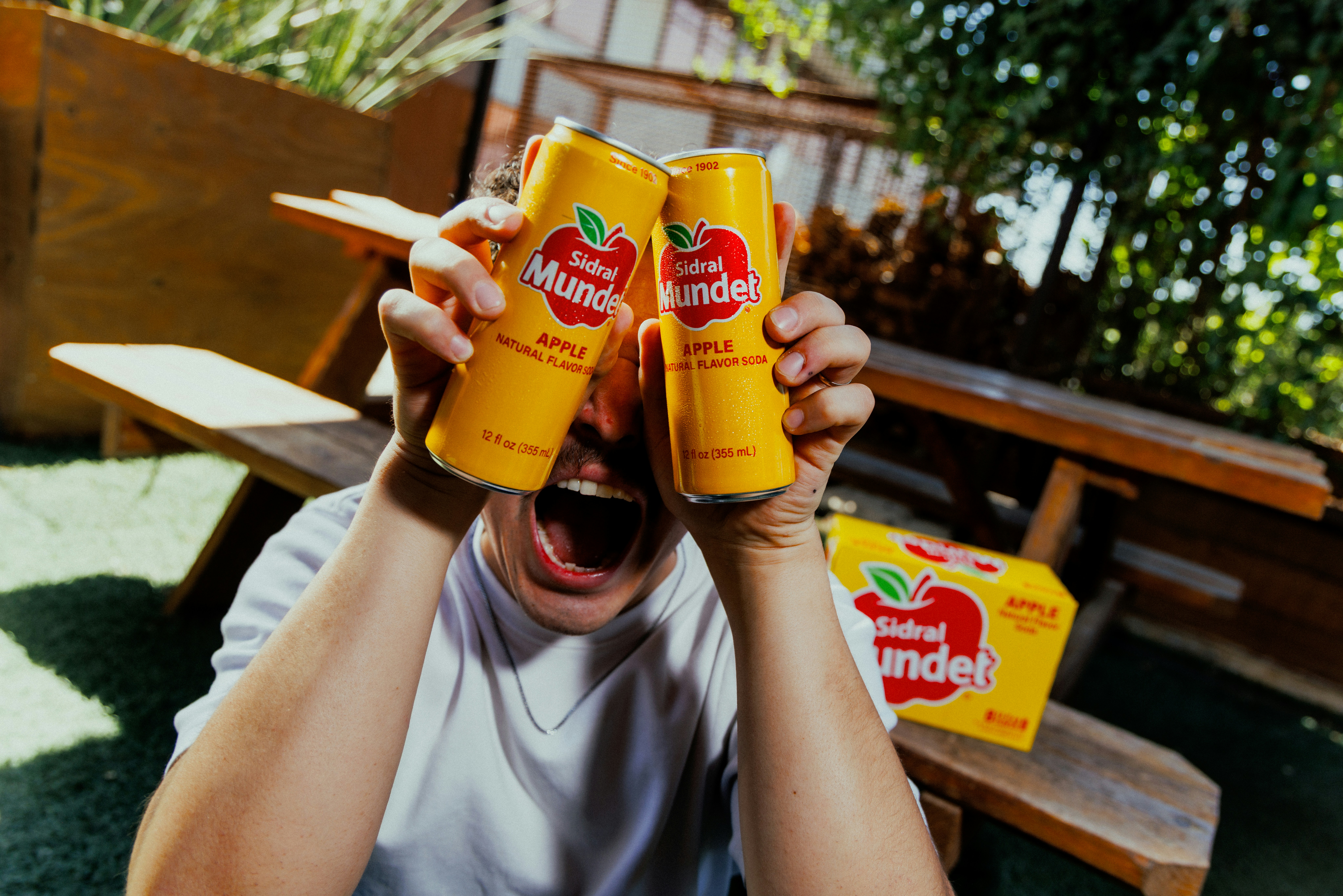 Two Soda Cans, One Shared Moment: A Laugh-Filled Picnic Moment