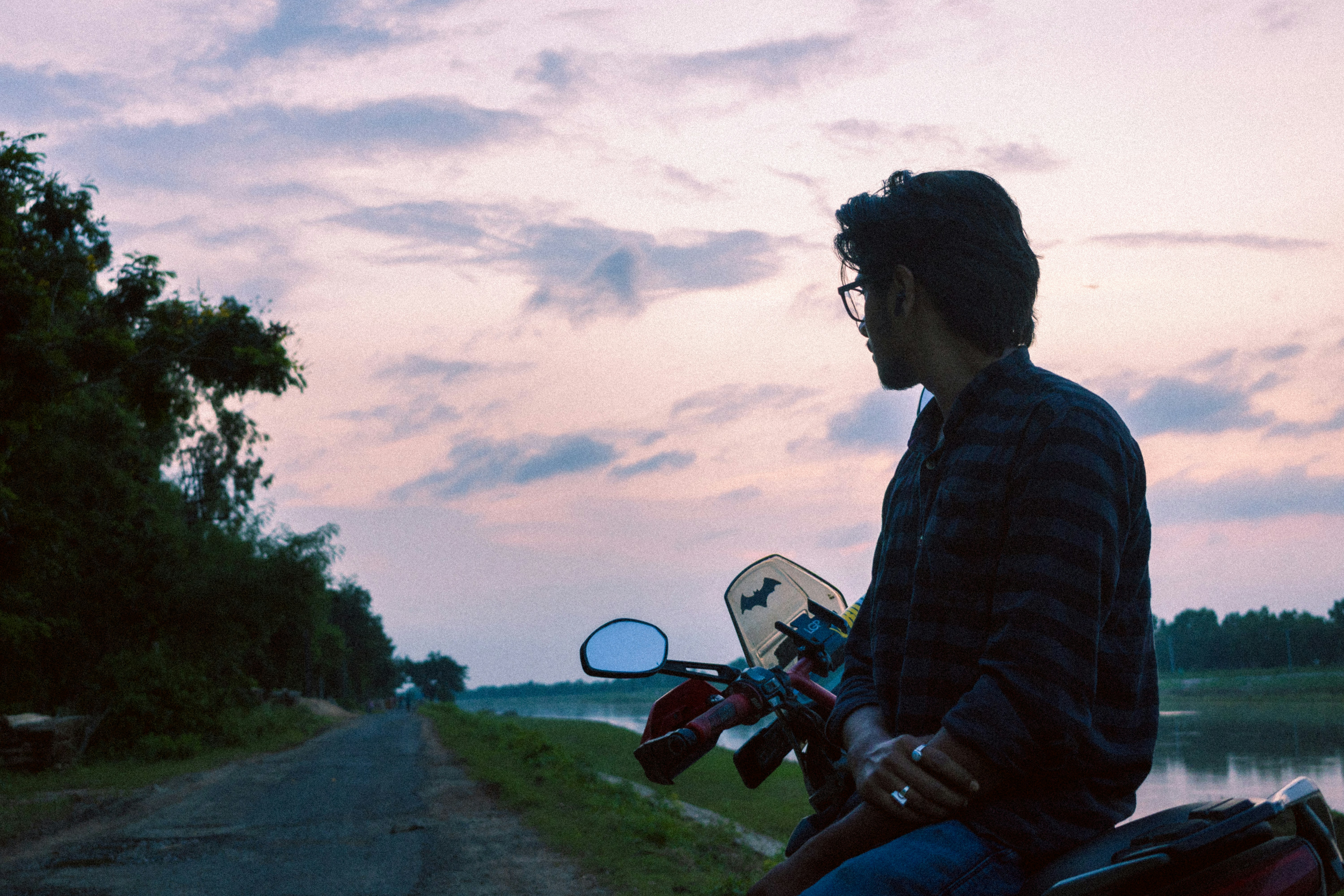 Evening Ride: A Quiet Moment with the Rider by the Distant Road