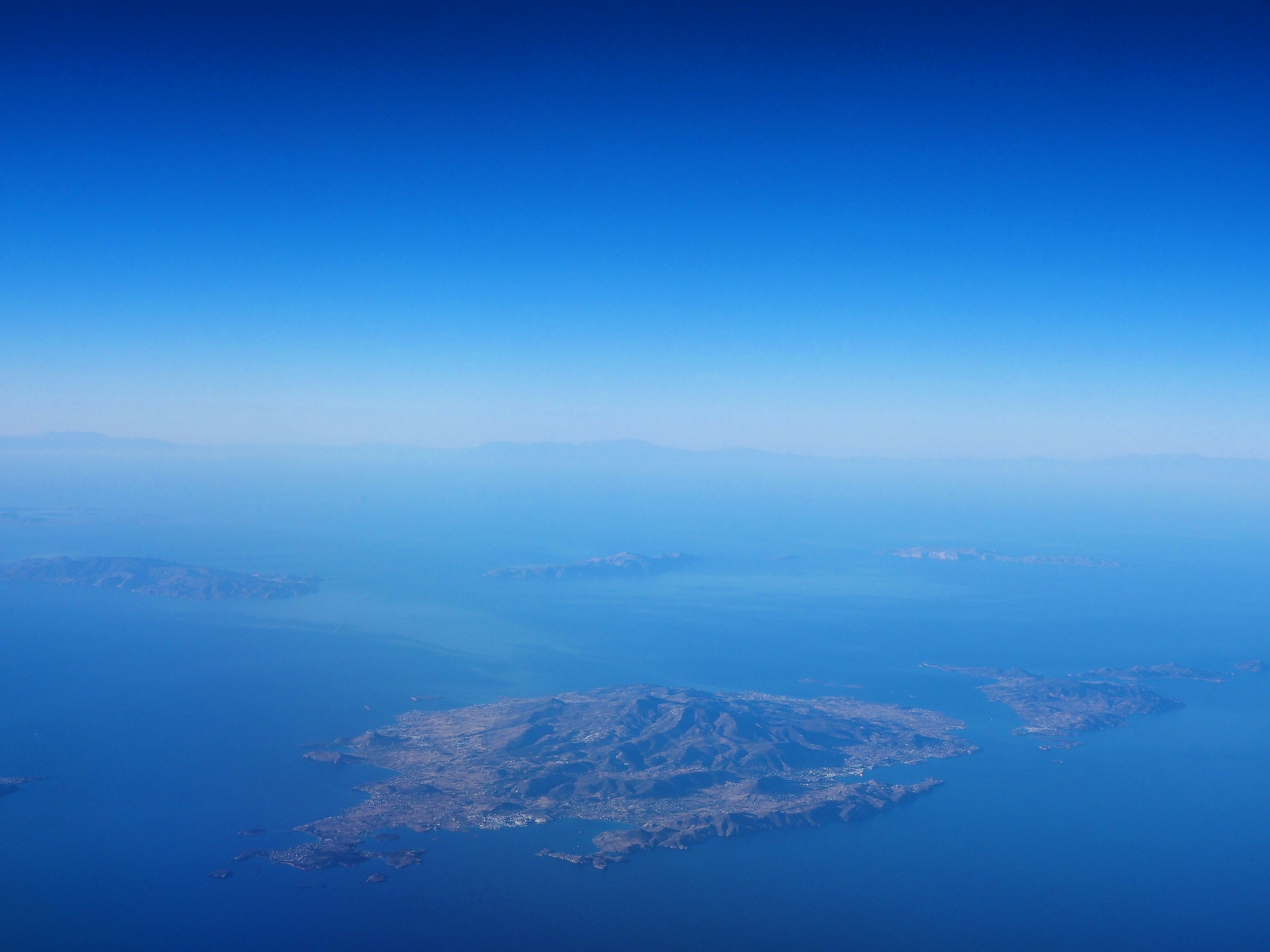 Azure Isles: Aerial Drift Over Sea and Islands