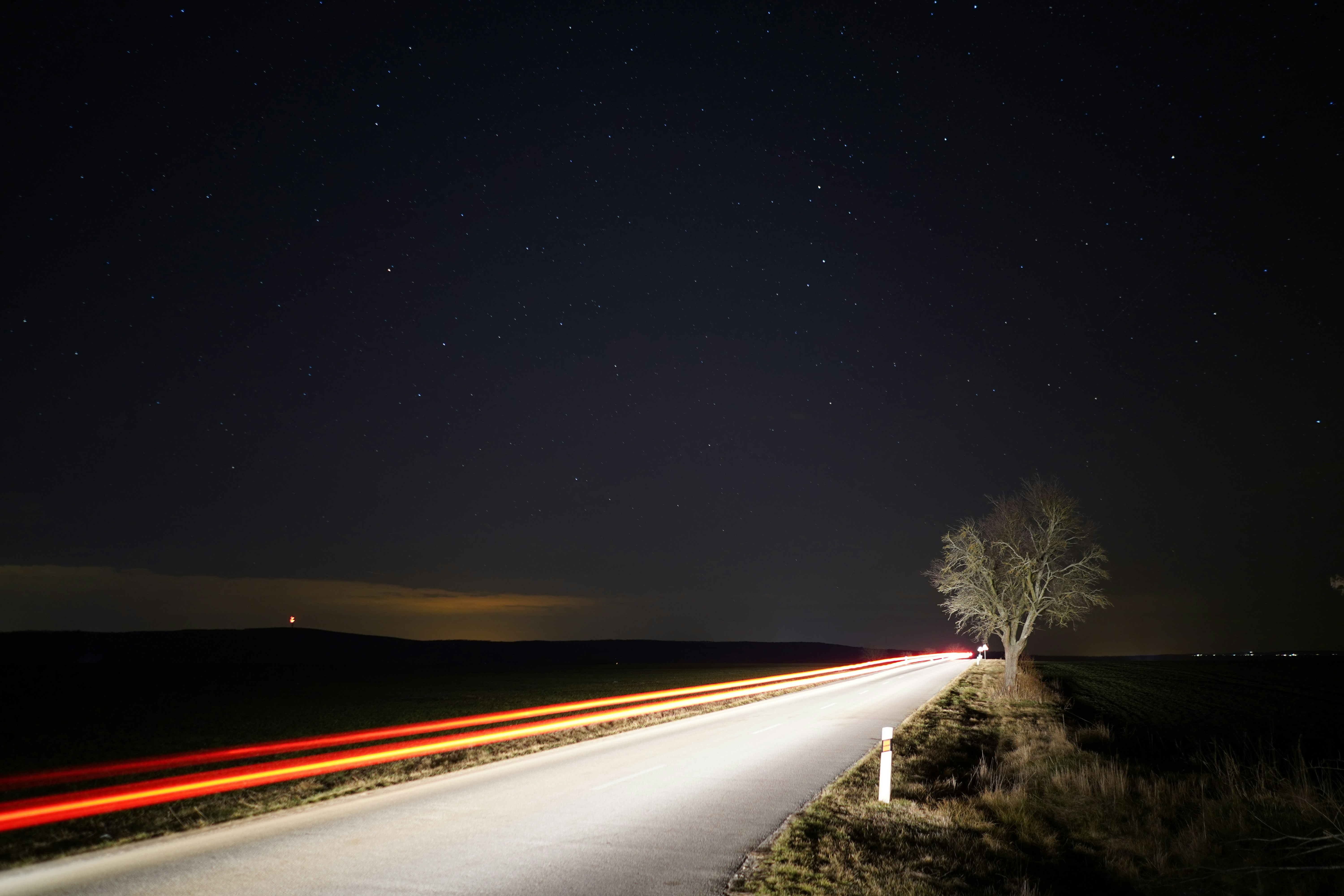 Lonely Night Road: Starry Silence and Tail Lights
